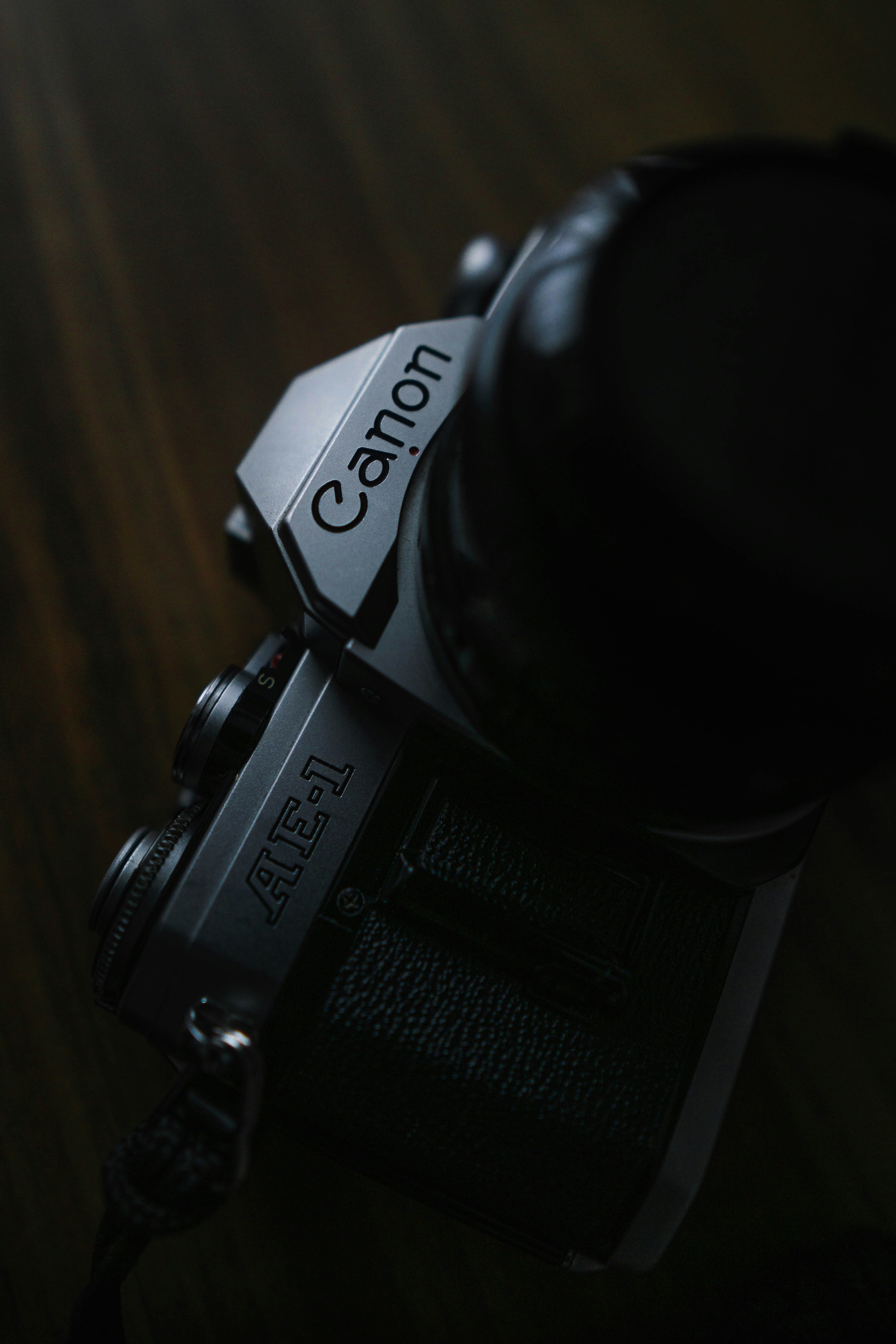 Close-up of a Canon AE-1 camera showcasing its distinctive design and vintage appeal.