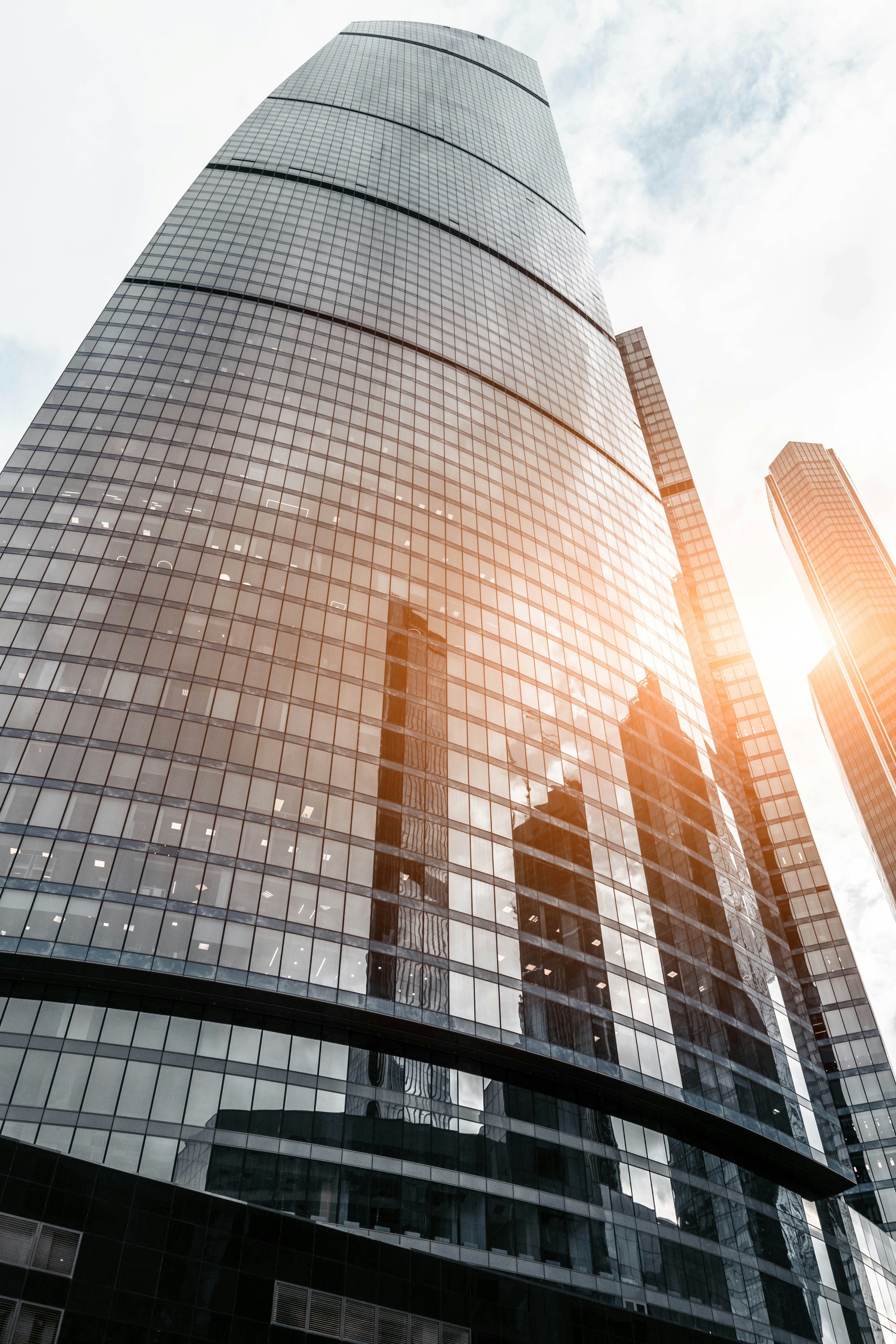 Worm view photo of buildings under cloudy sky photo – Free Russia Image ...