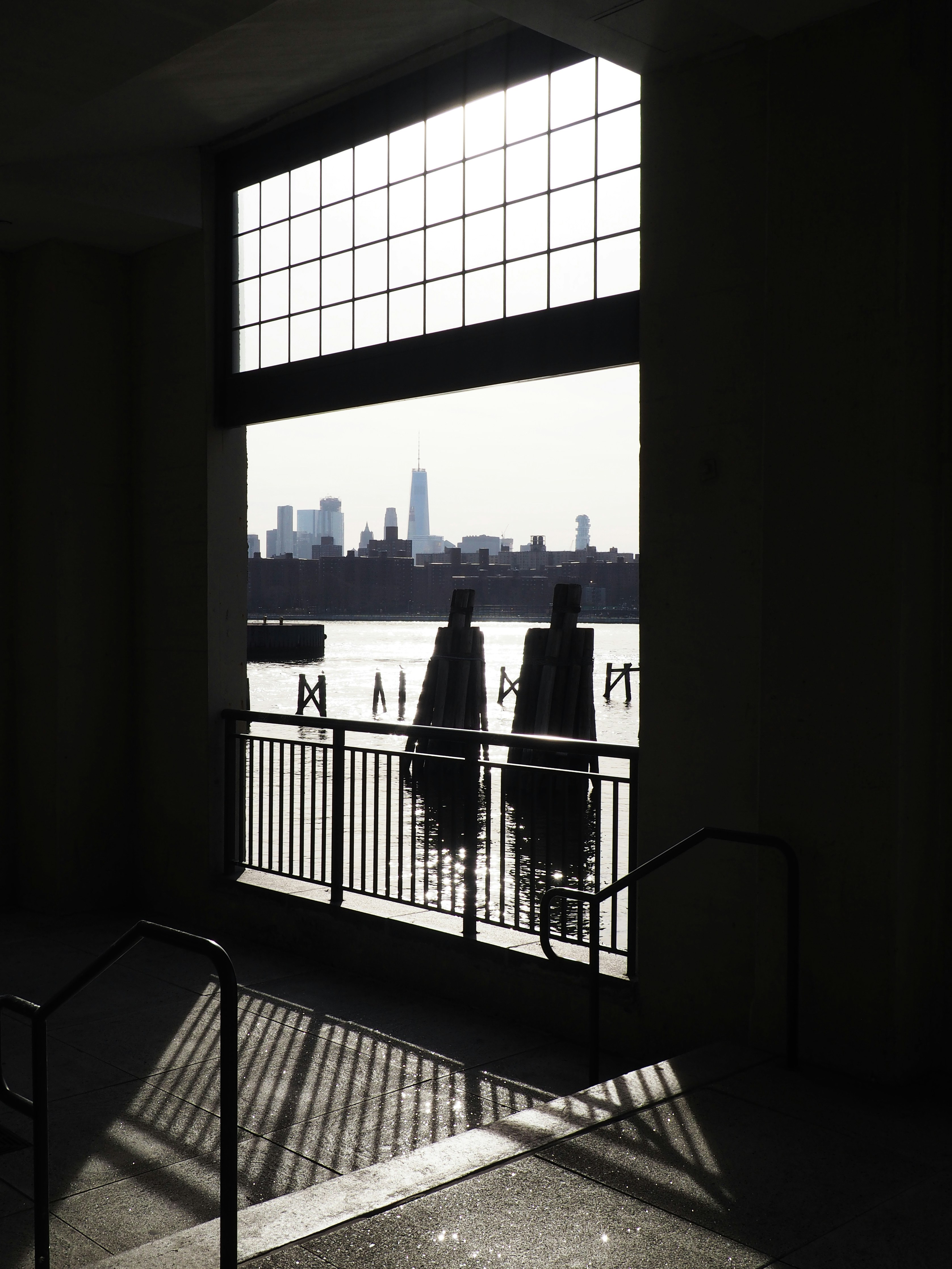 Grid-Window Horizon: Pier Silhouettes Meet a Distant Skyline