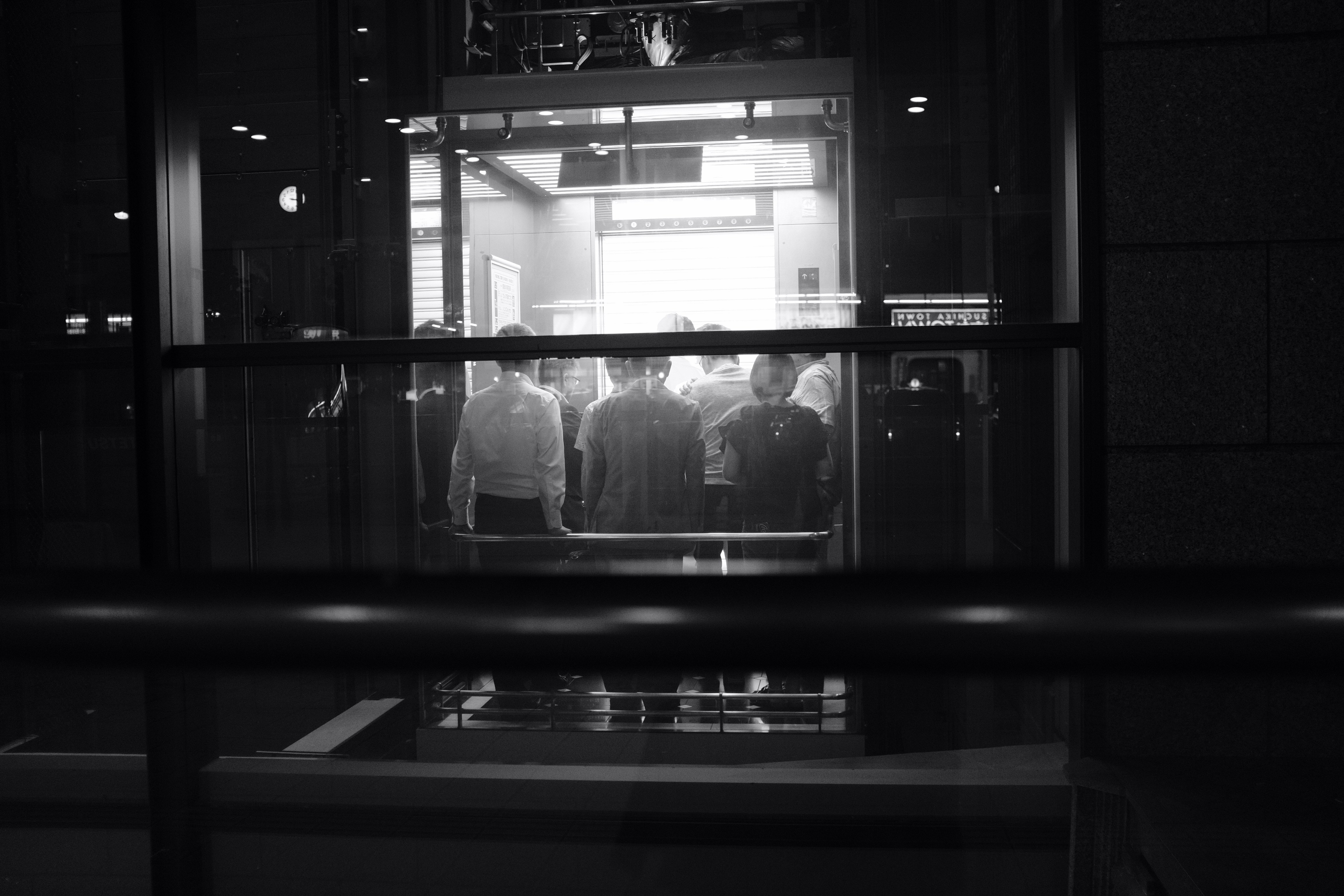 People inside elevator in monochrome photo photo – Free Grey Image on ...