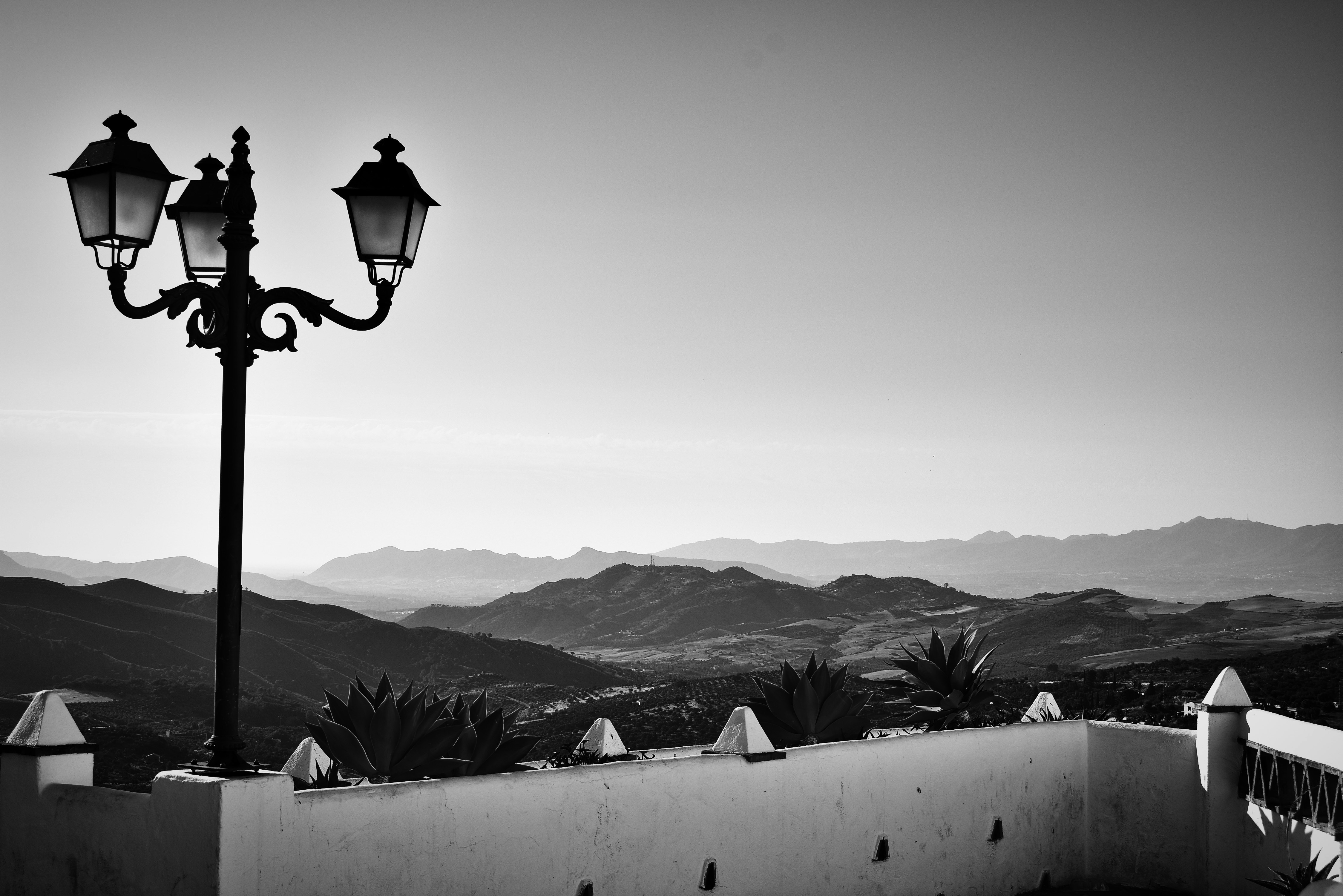 Lone Lantern Over a Terraced Horizon