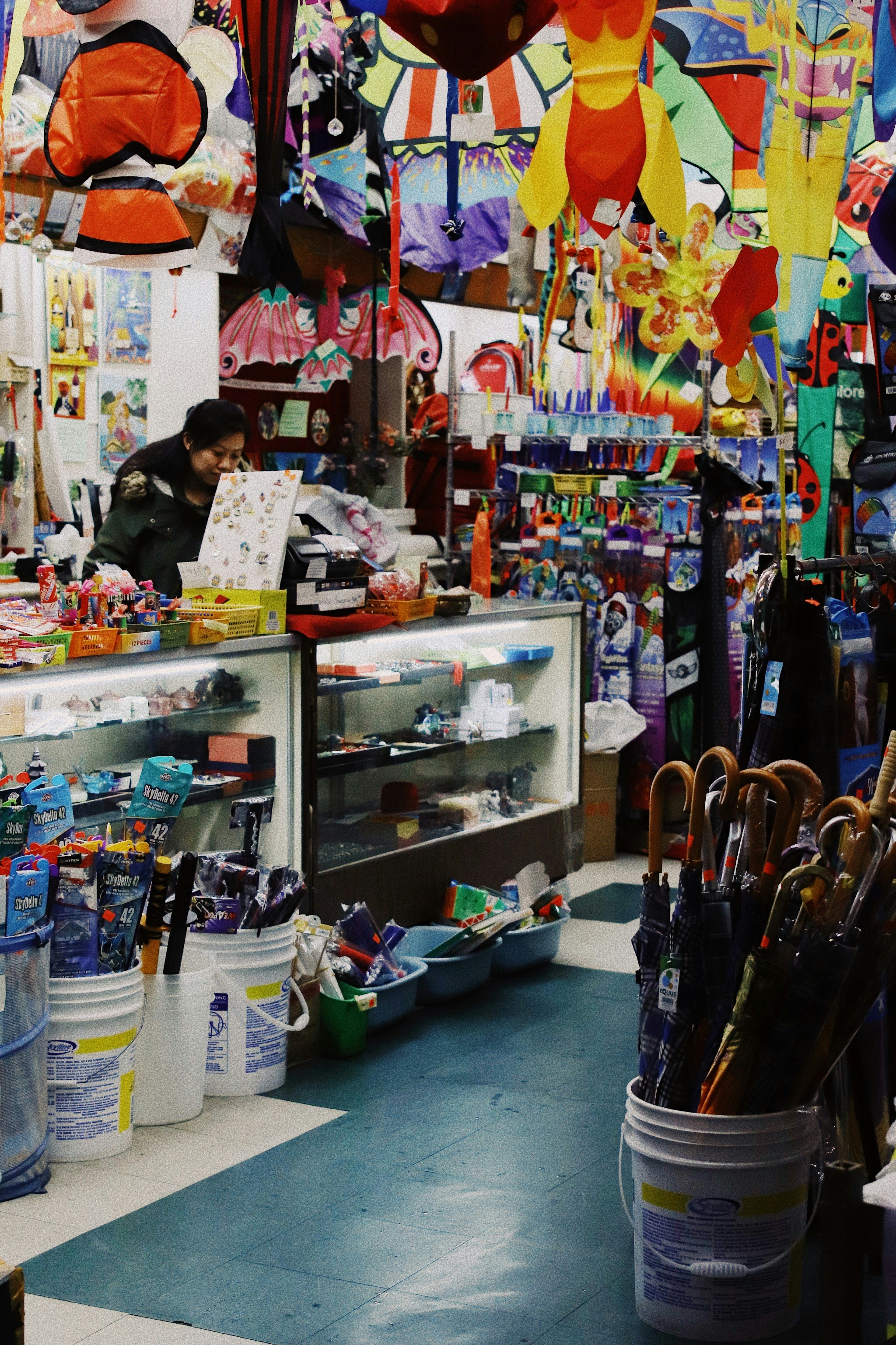 Colorful Bazaar: A Shop Interior Brimming with Kites, Toys, and Umbrellas