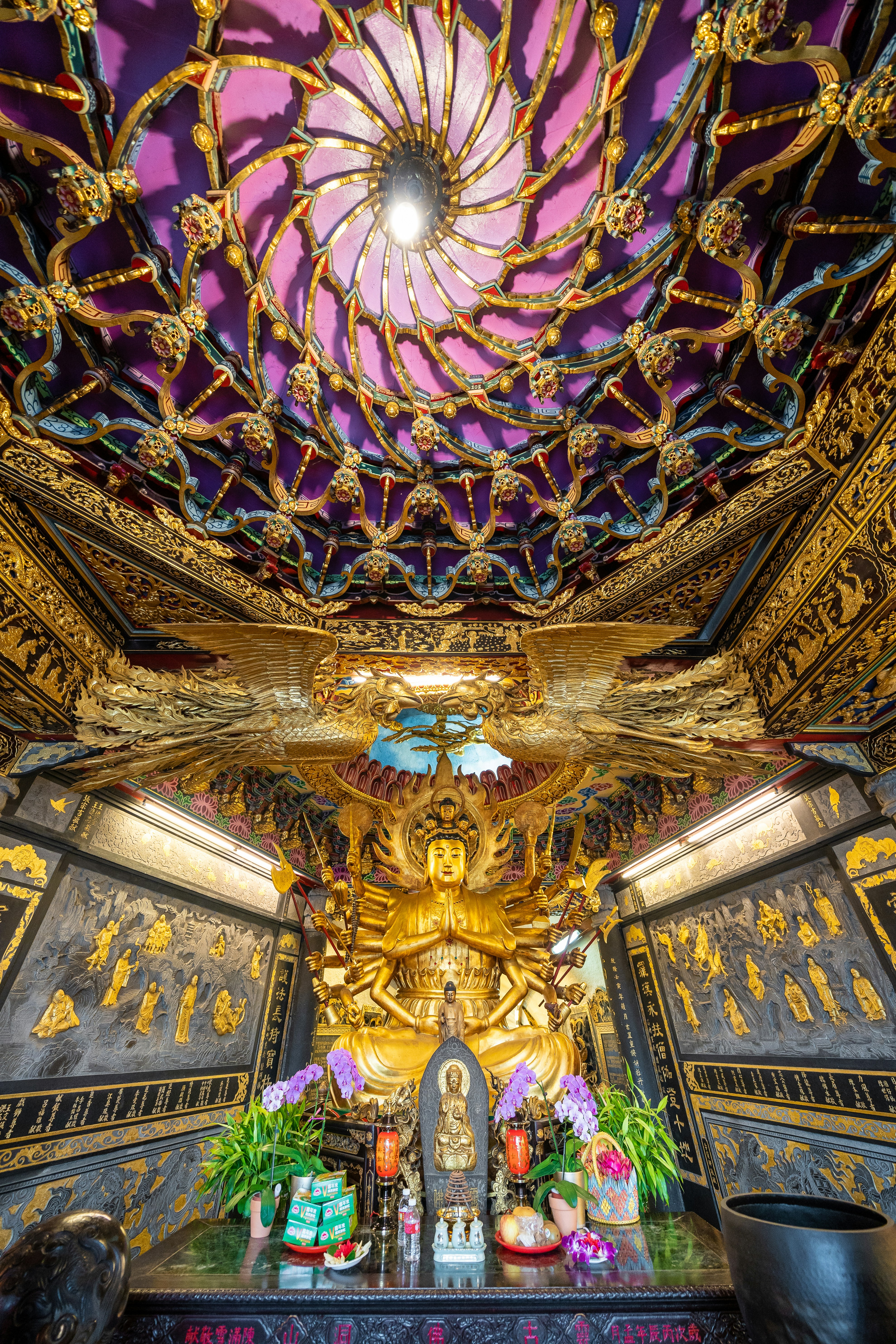 Sacred Spiral: Golden Statue Beneath an Ornate Rotunda