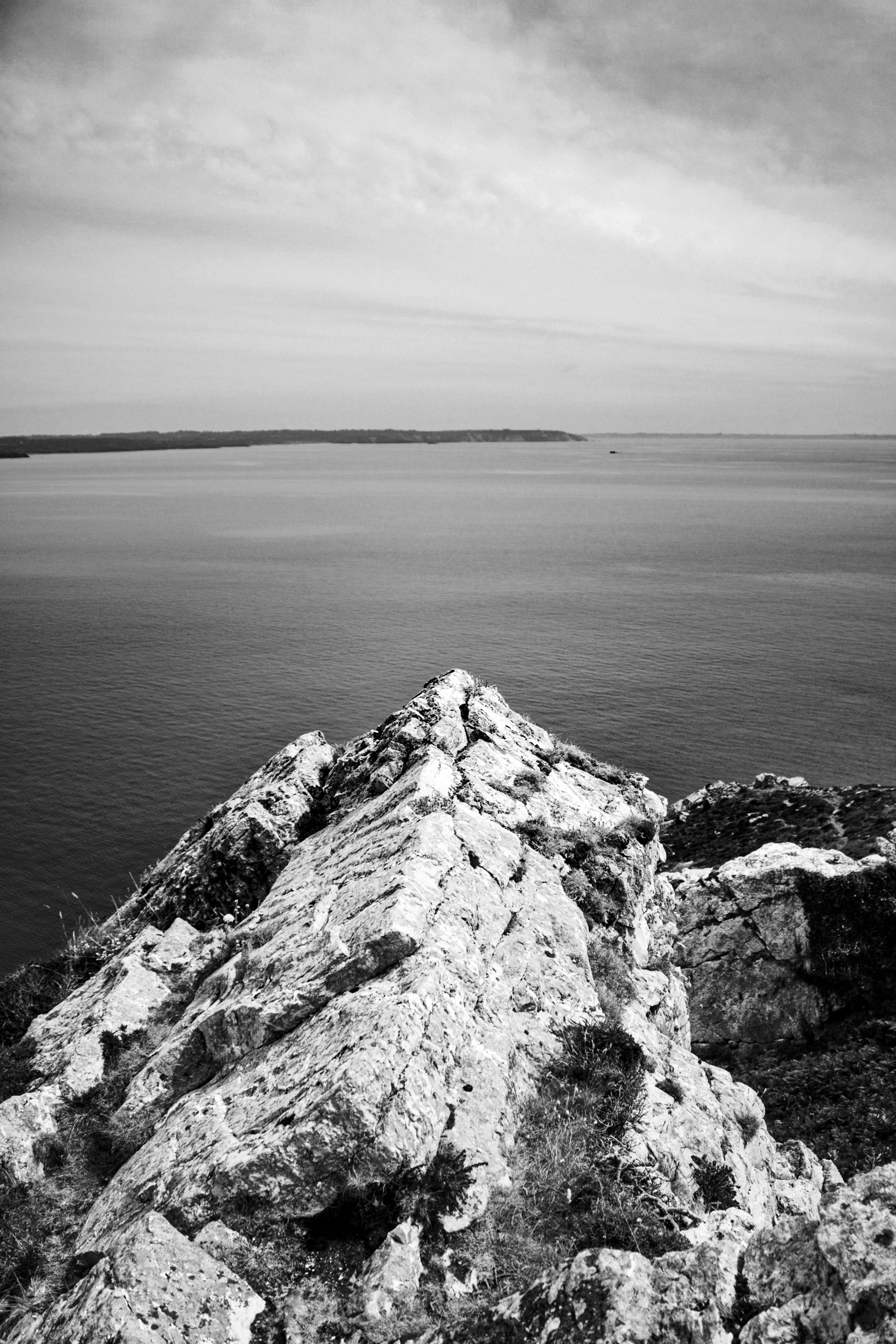 Grayscale photography of cliff and body of water photo – Free Grey ...