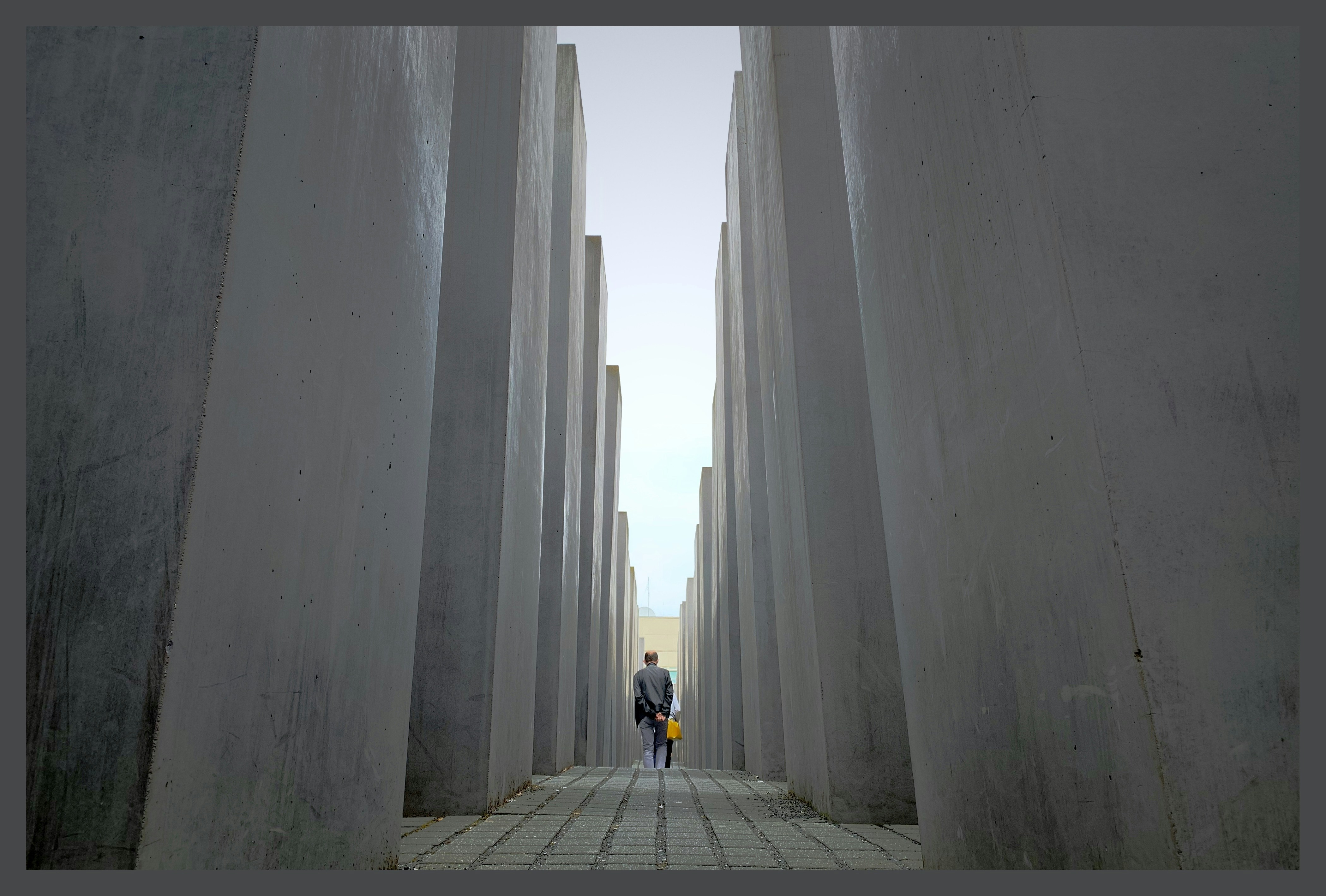 Man standing beside wall photo – Free Grey Image on Unsplash