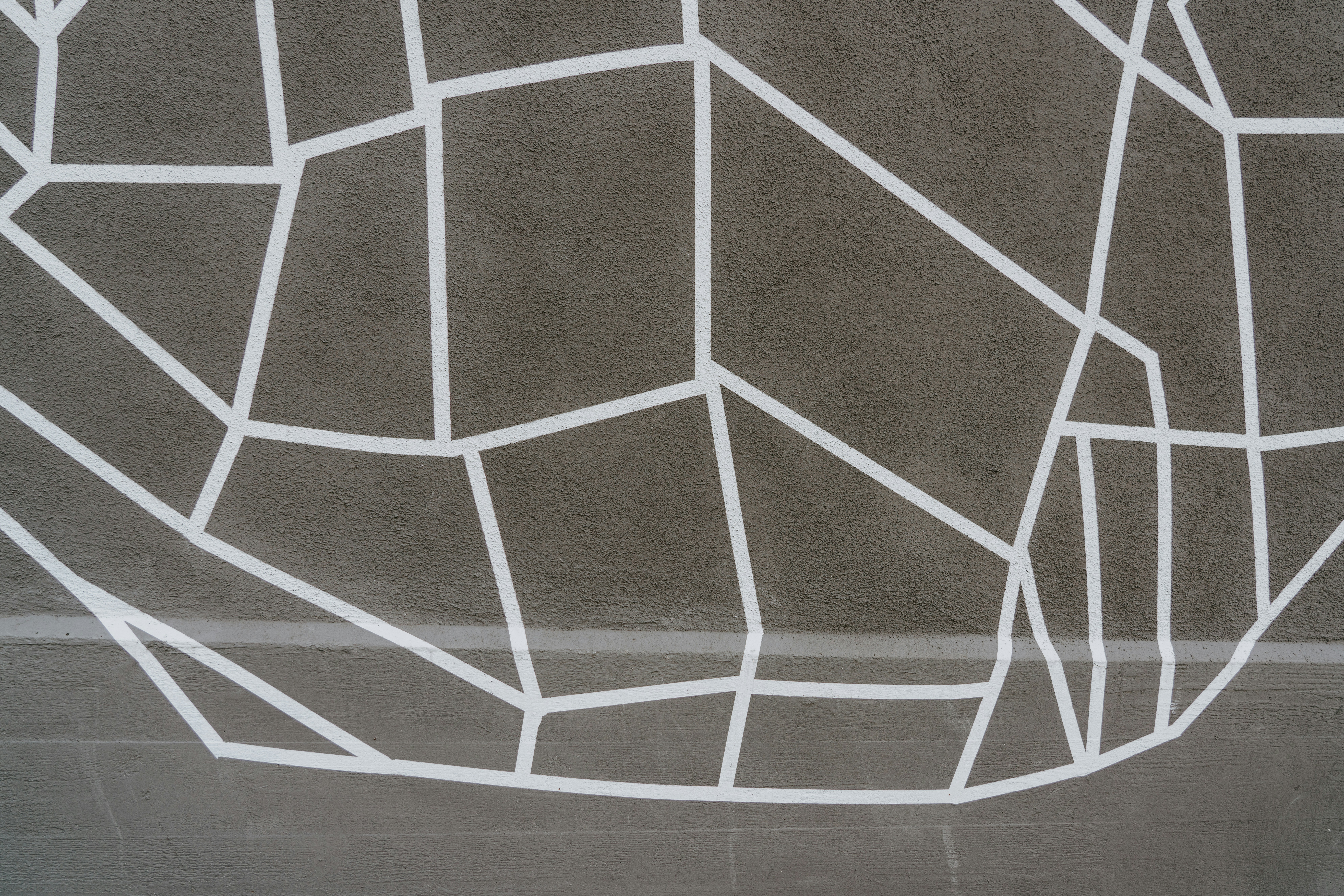 A white line drawing on the side of a building photo – Free Team Image ...