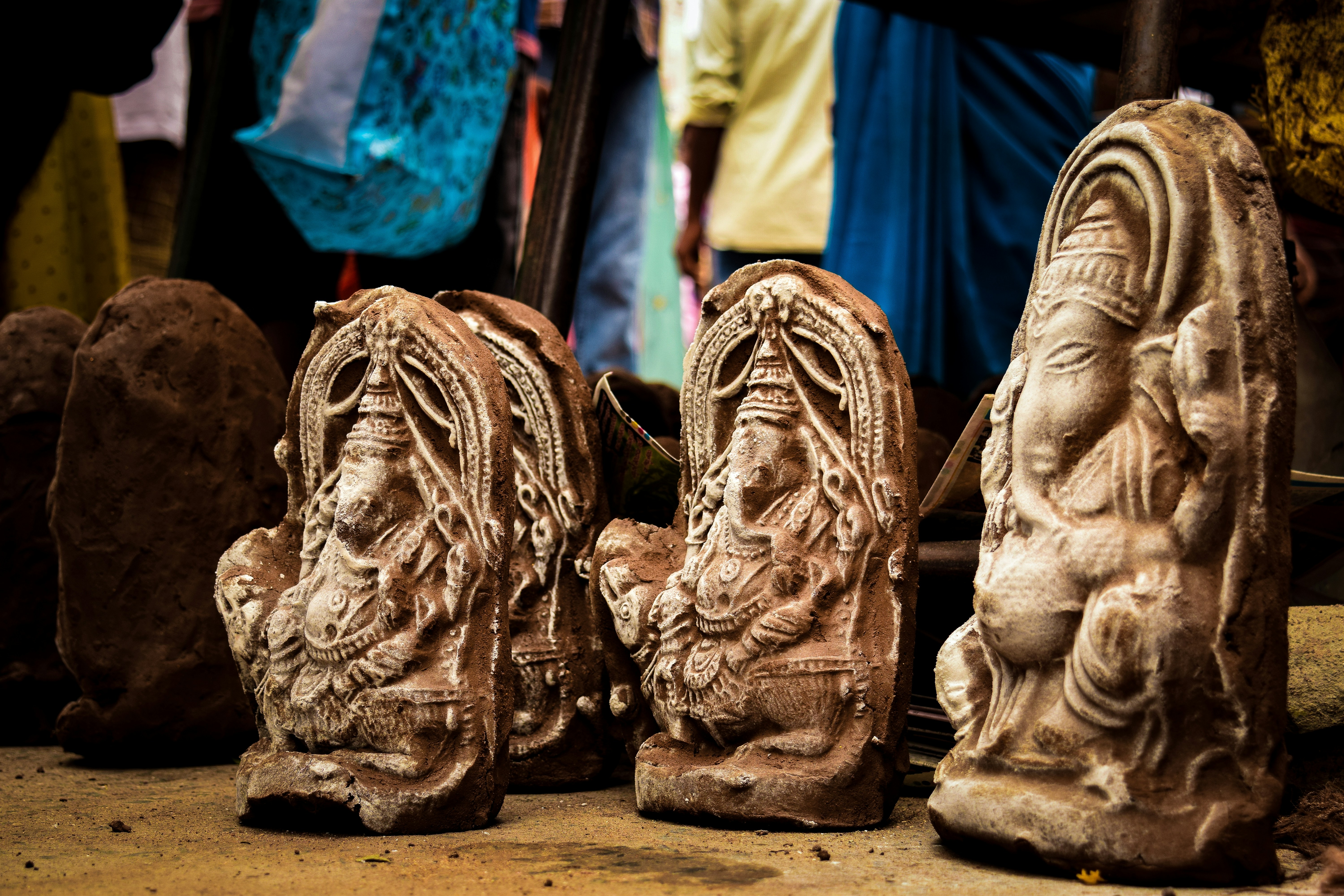 Stone Figures in Market Shadow