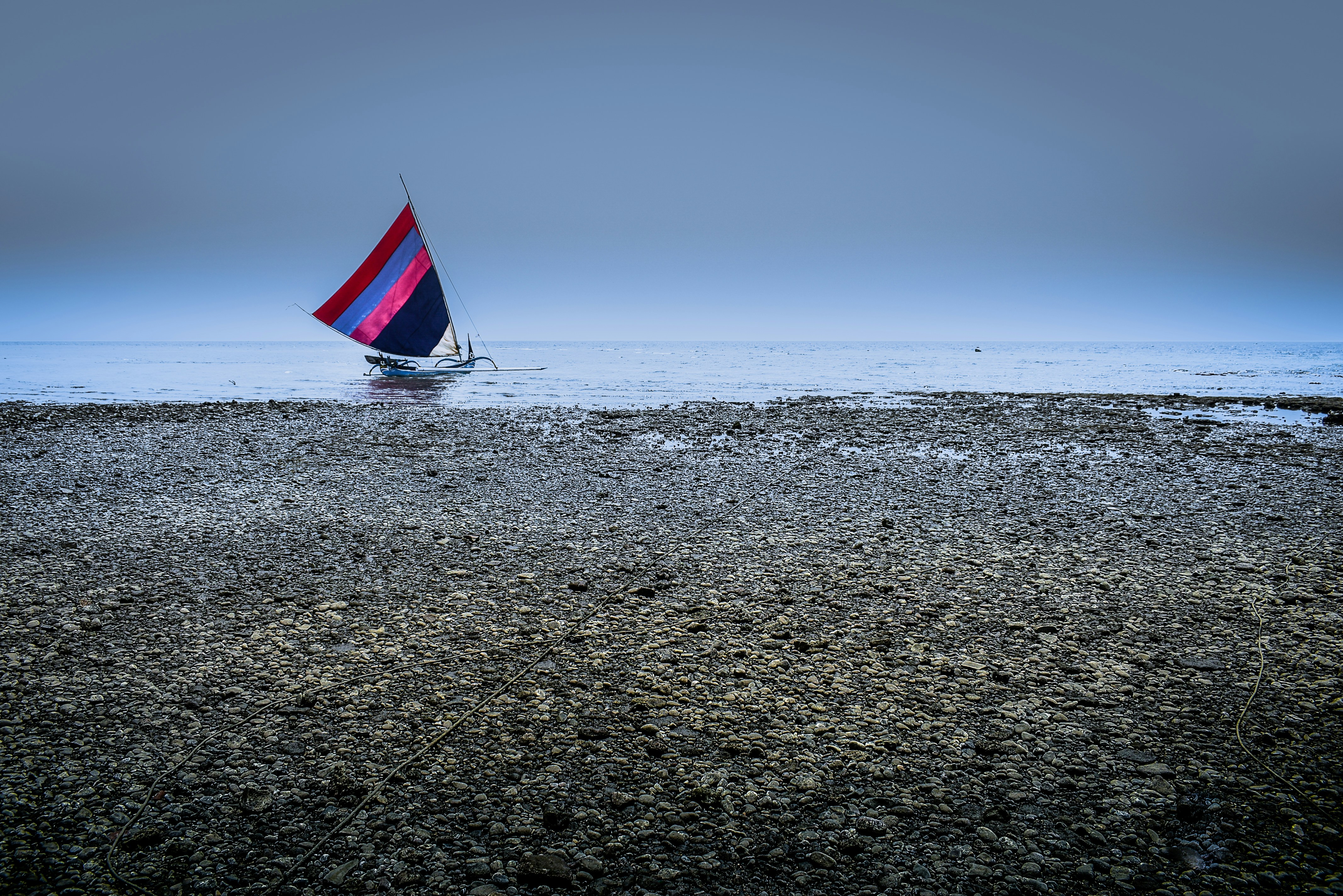 Sail on the Quiet Shore: A Lonely Boat at Dusk