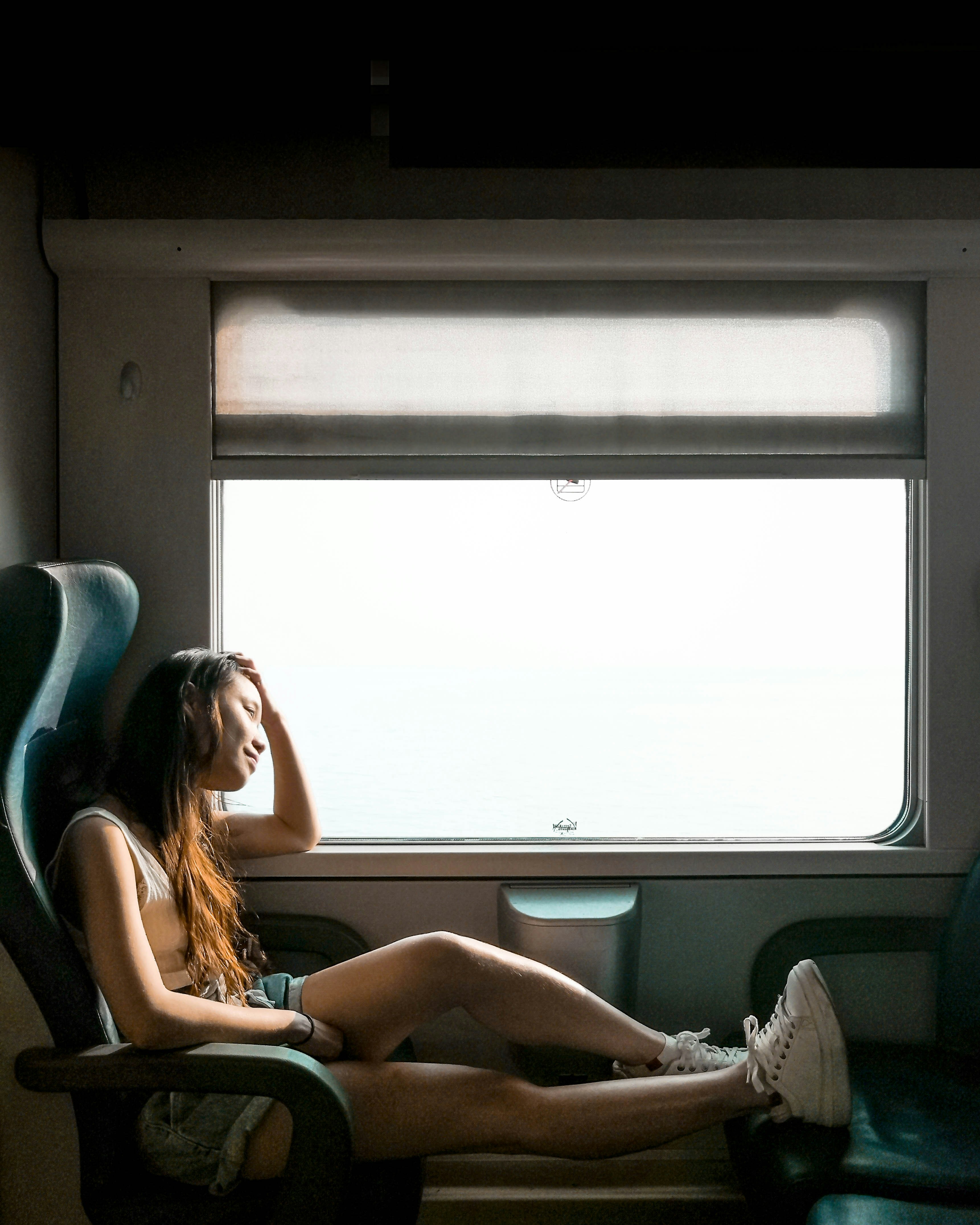 Sunlit Daydream by the Window Seat on a Quiet Railcar