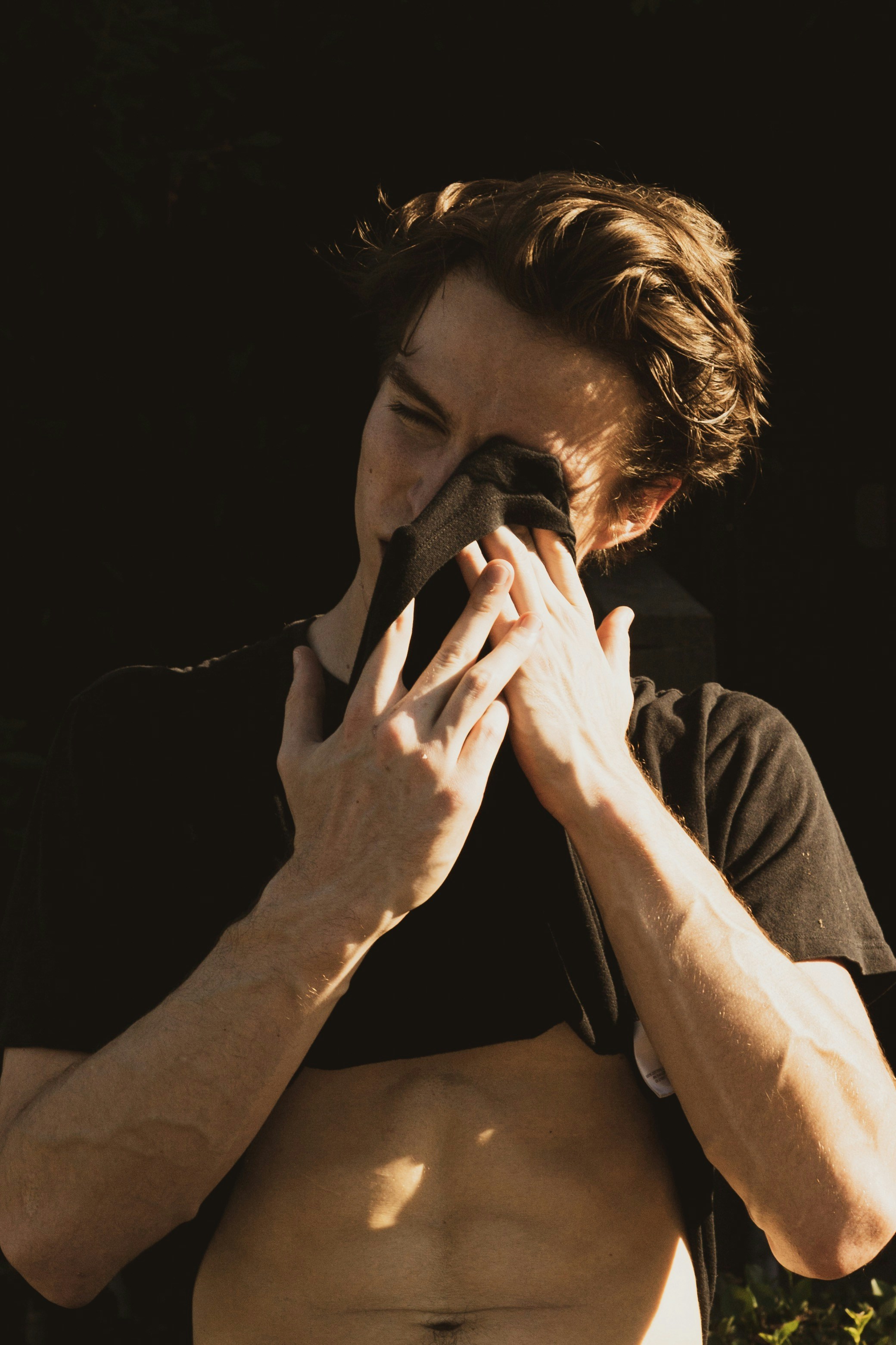 Man wiping his eyes while standing photo – Free People Image on Unsplash