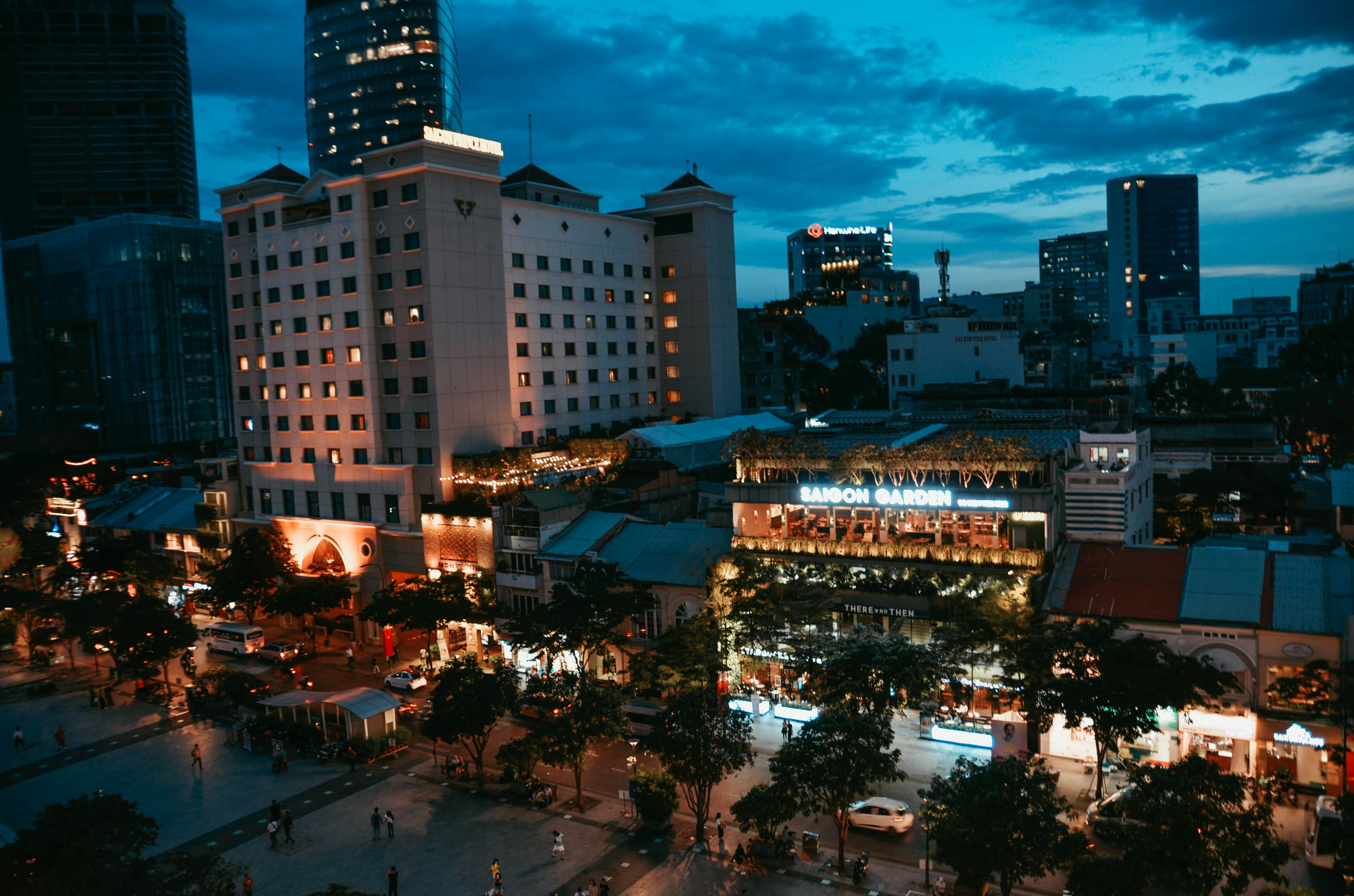Blue Hour Beacon: The White Hotel Anchoring a Luminous Downtown