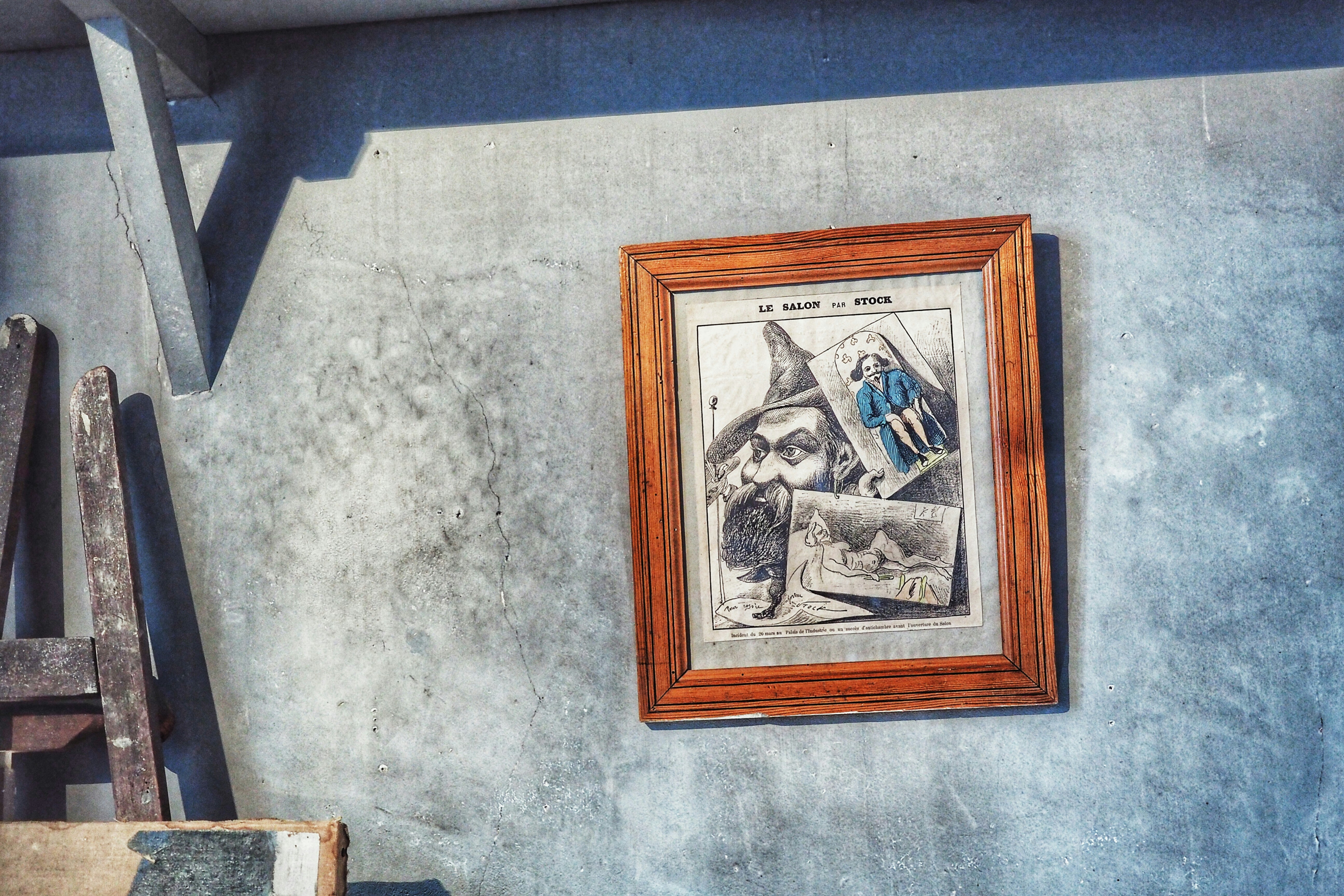 Framed Sketch on Weathered Blue Wall