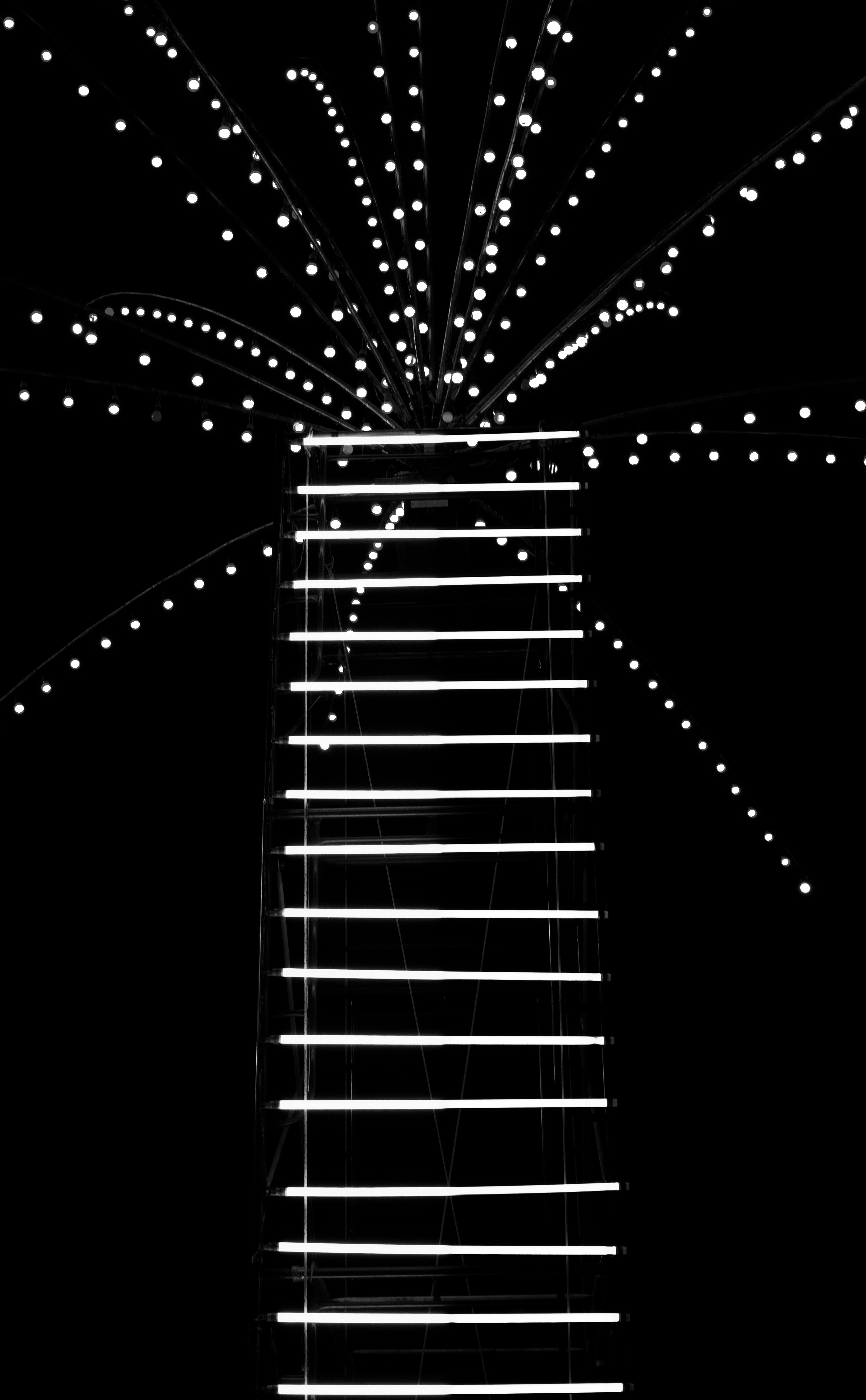 Radial Light Burst Above a Slatted Monolith