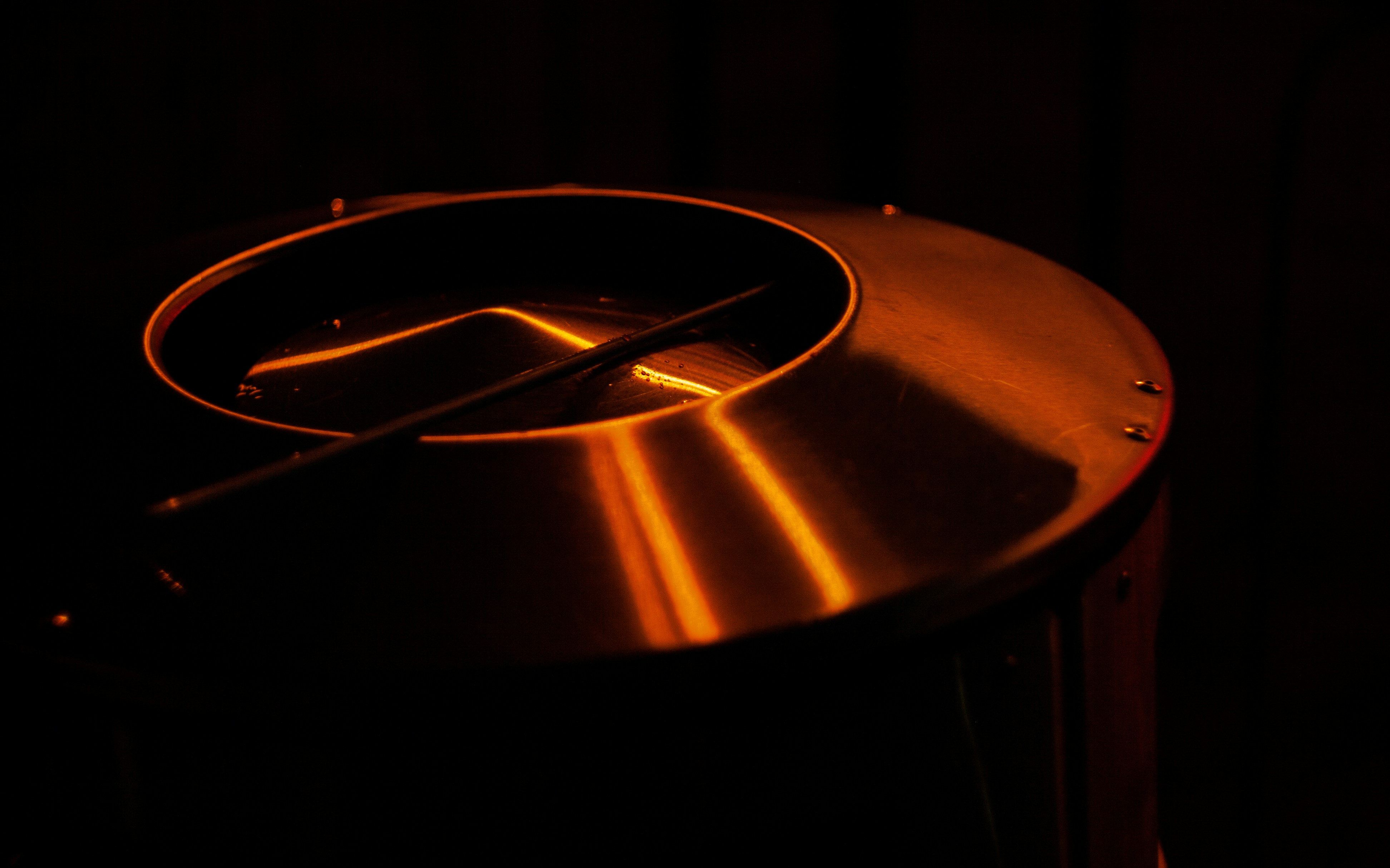 Glowing Ring: A Quiet Moment Inside a Copper Lamp