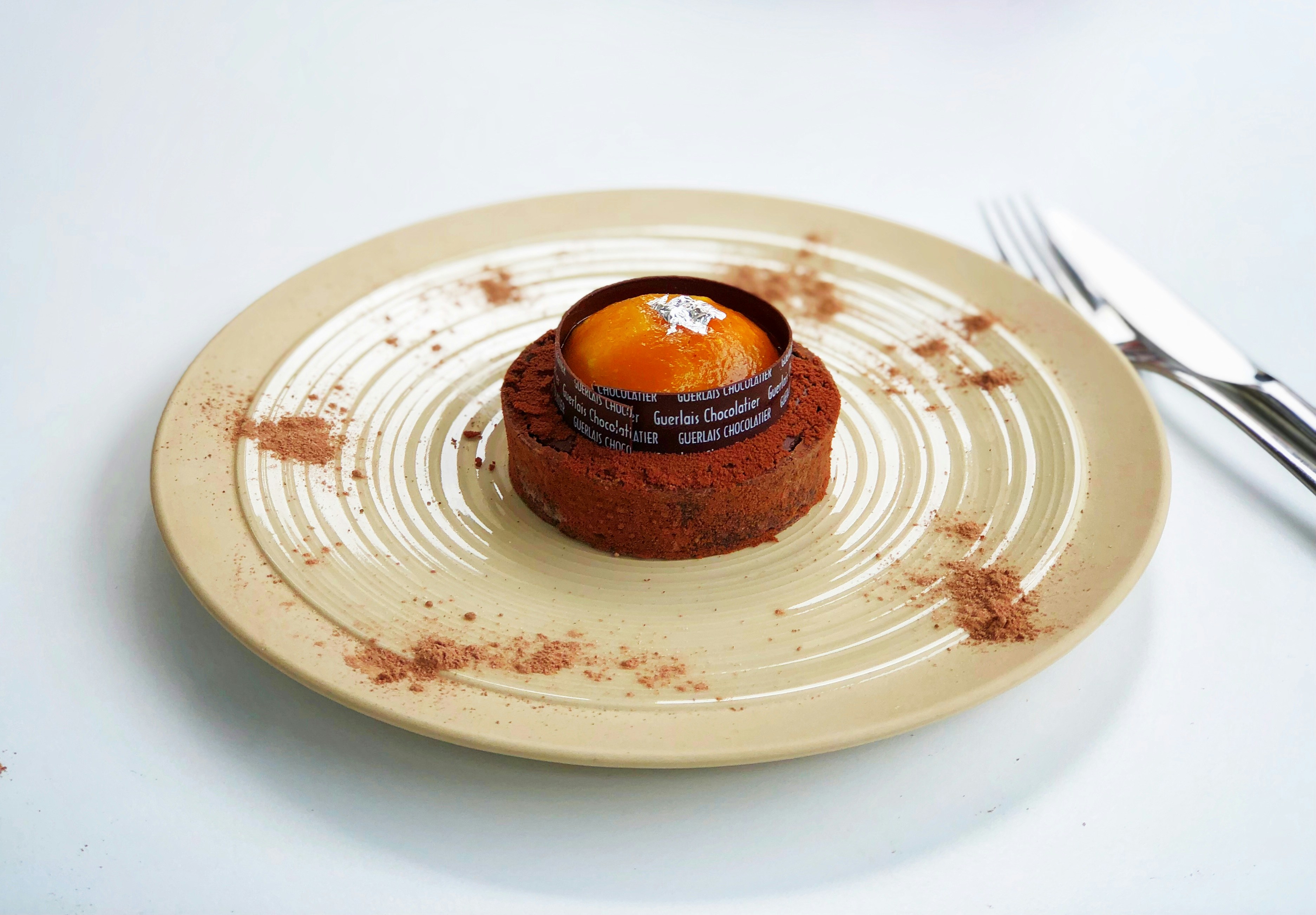 Citrus-Glazed Chocolate Tart centerpiece on a Minimalist Plate