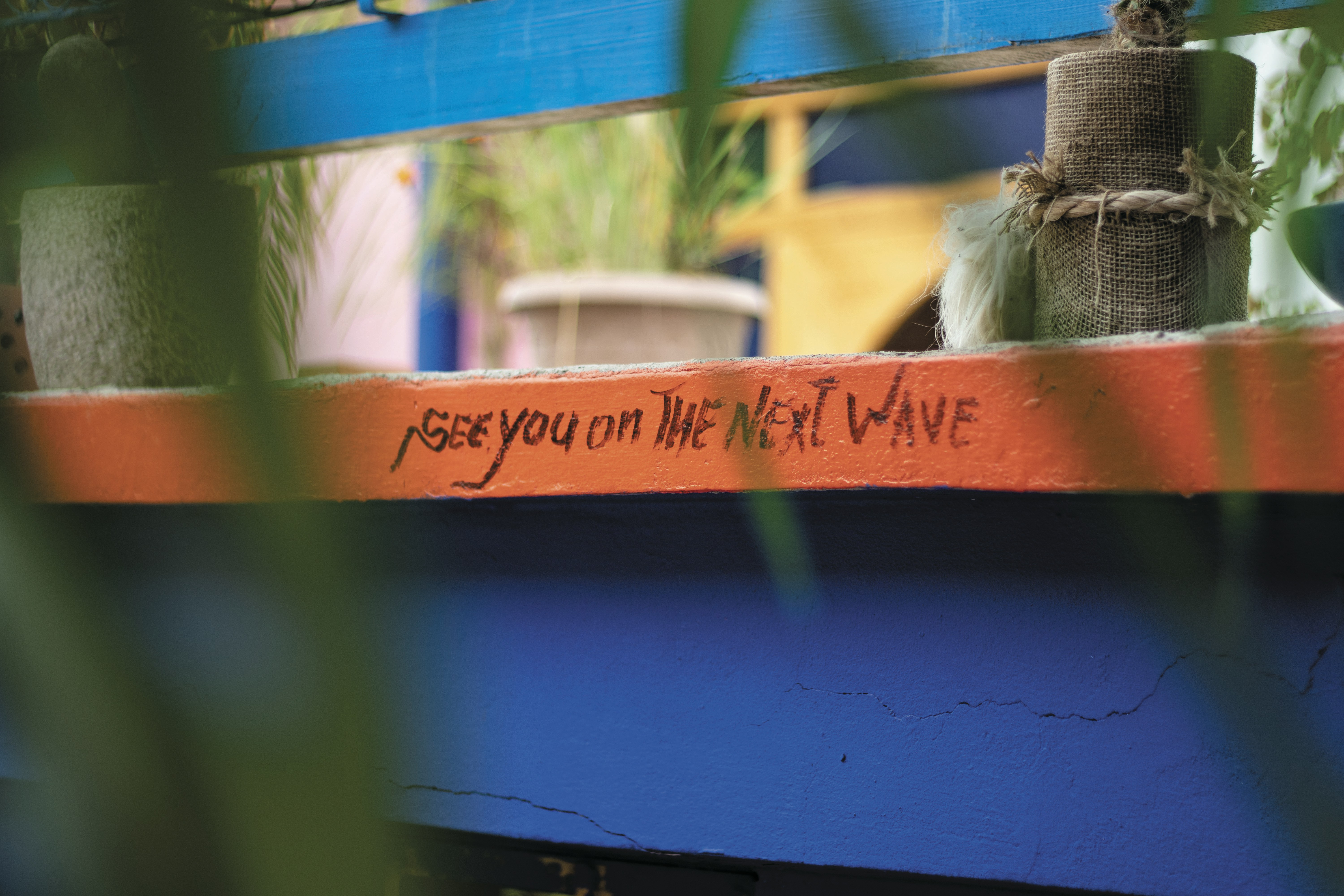 See You on the Next Wave: Graffiti Inscription on a Weathered Veranda