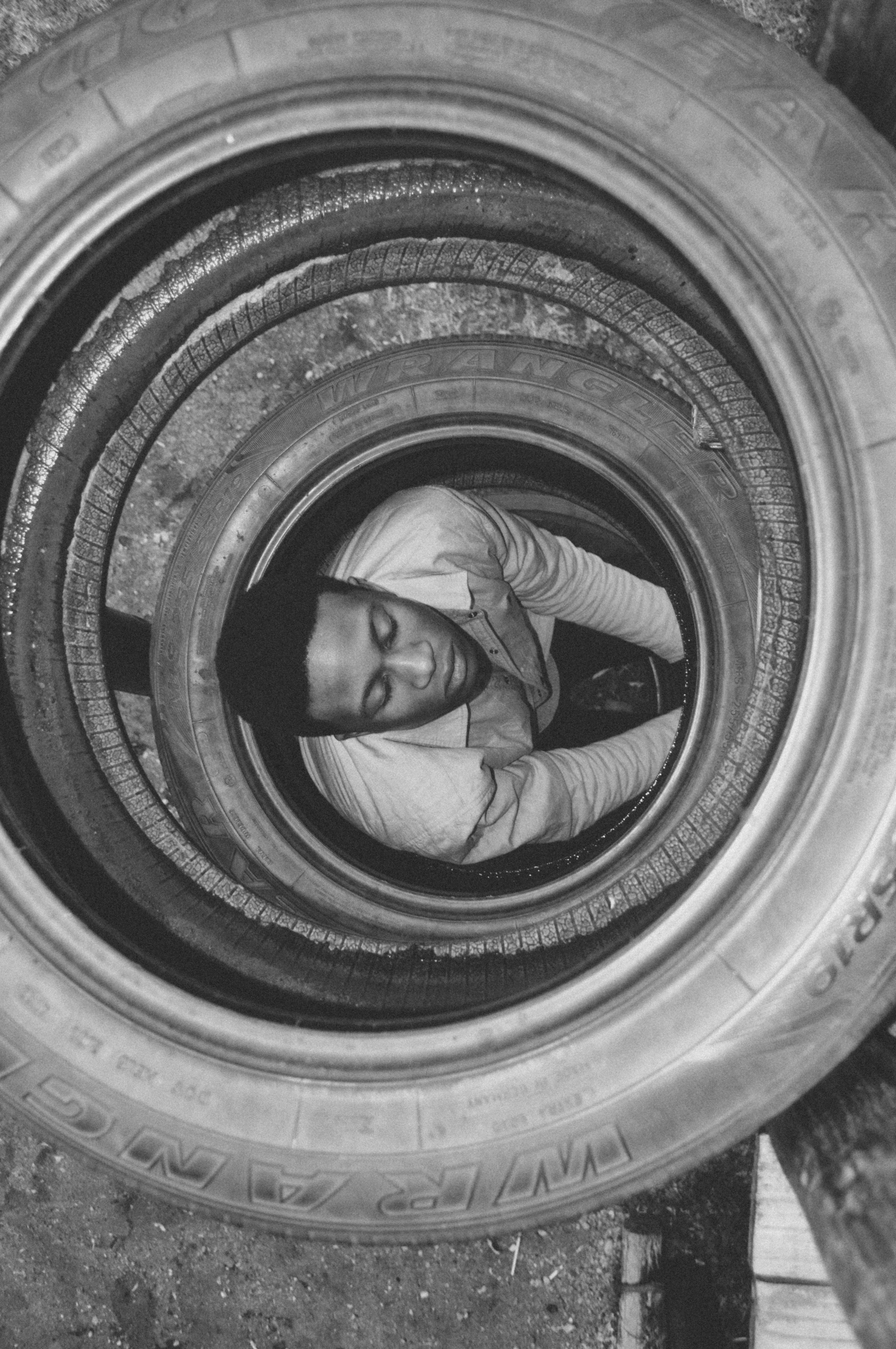 Man inside tires photo – Free Human Image on Unsplash