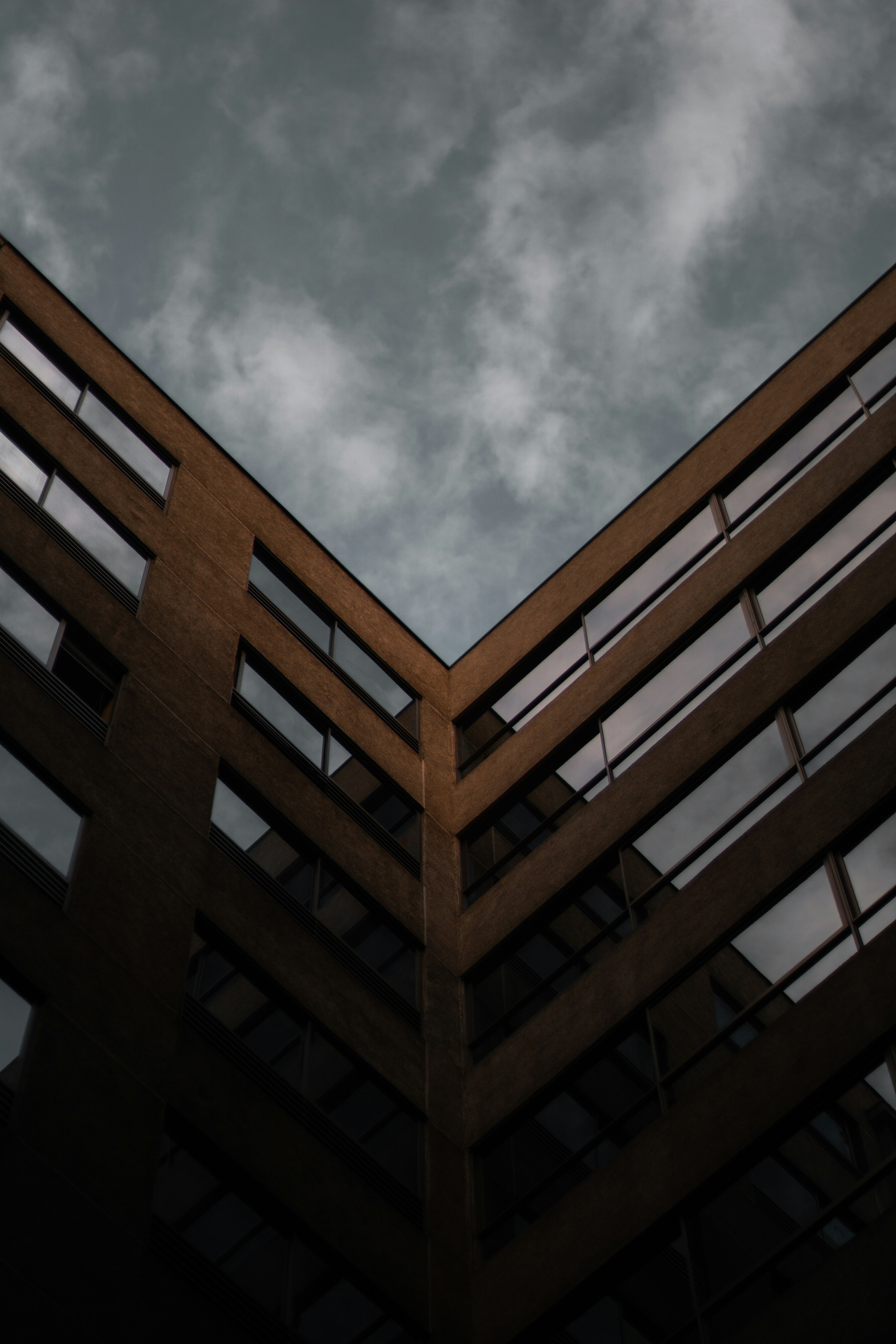 V-Shaped Brick Facade Framing a Moody Sky