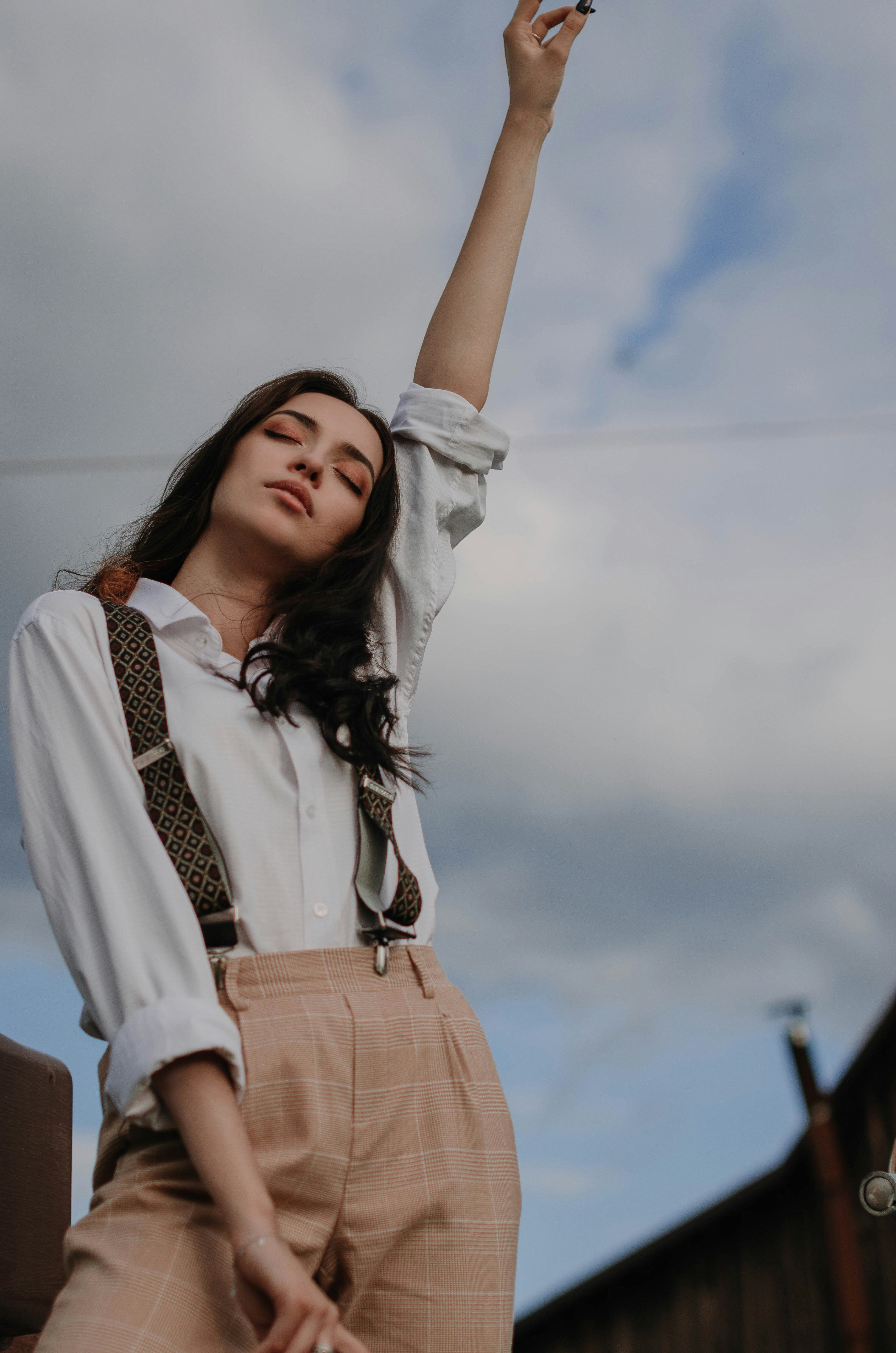 Woman raising right hand photo – Free Fashion Image on Unsplash