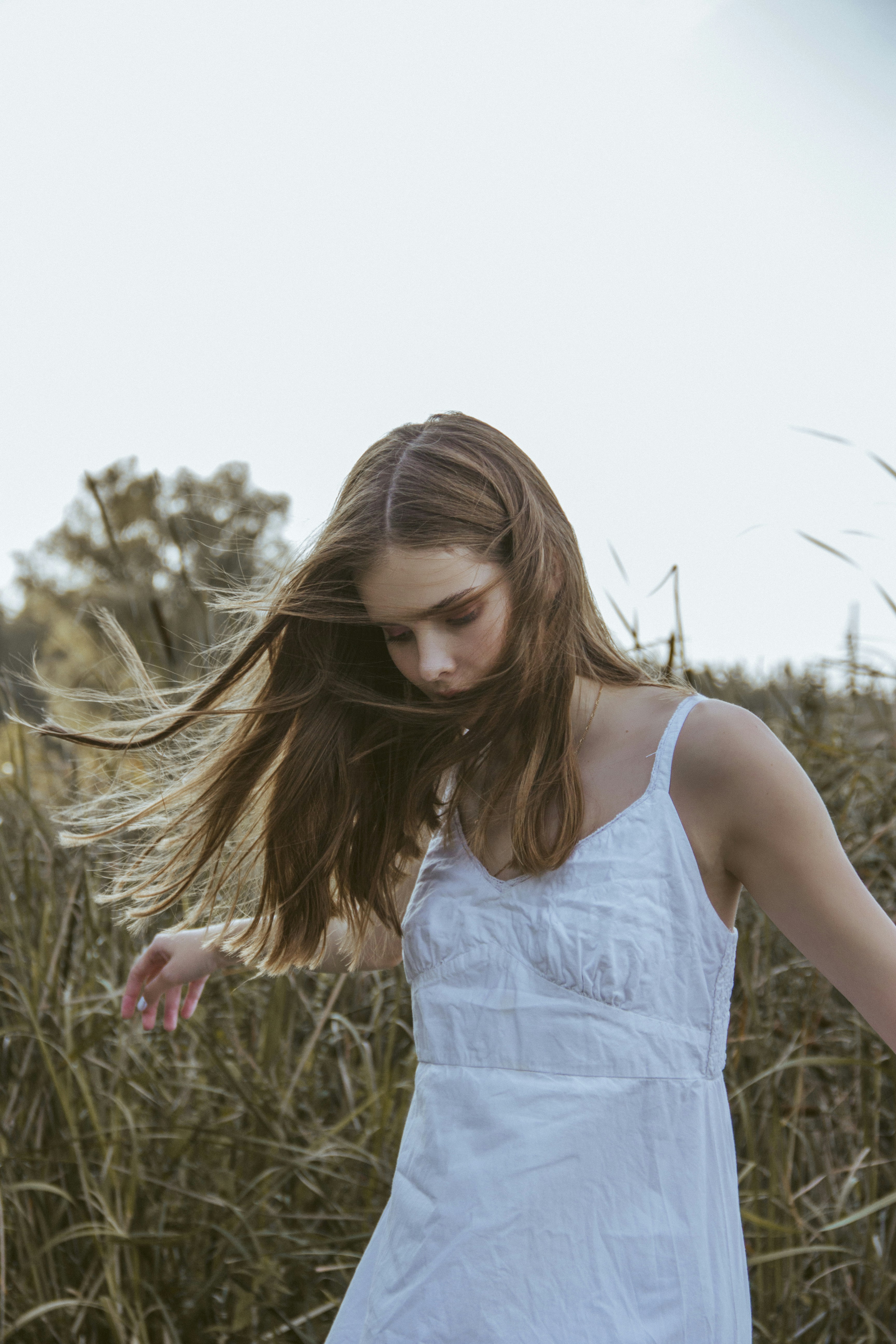 Woman standing beside grass field photo – Free Grey Image on Unsplash
