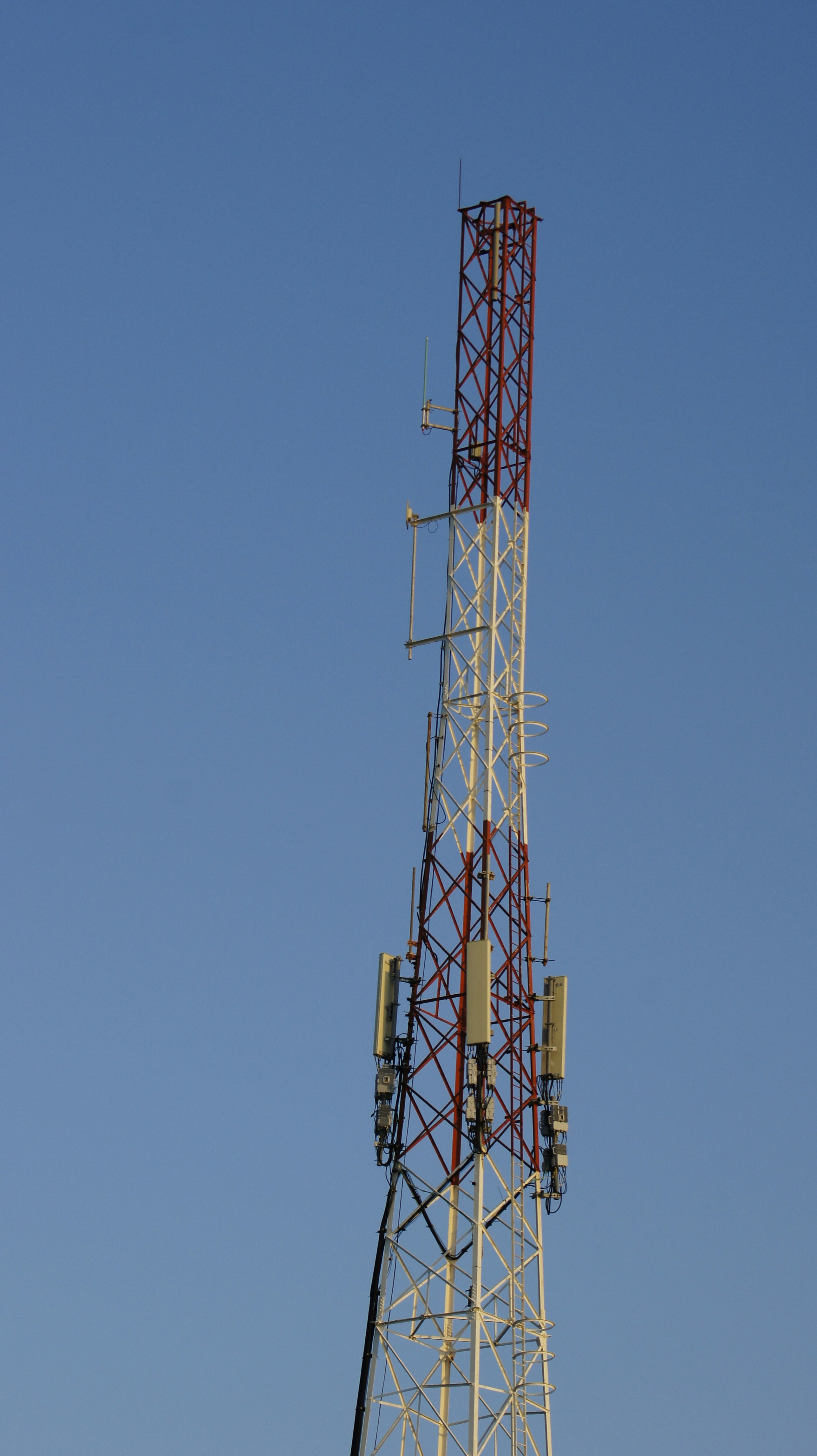 White and red transmission tower photo – Free Blue Image on Unsplash