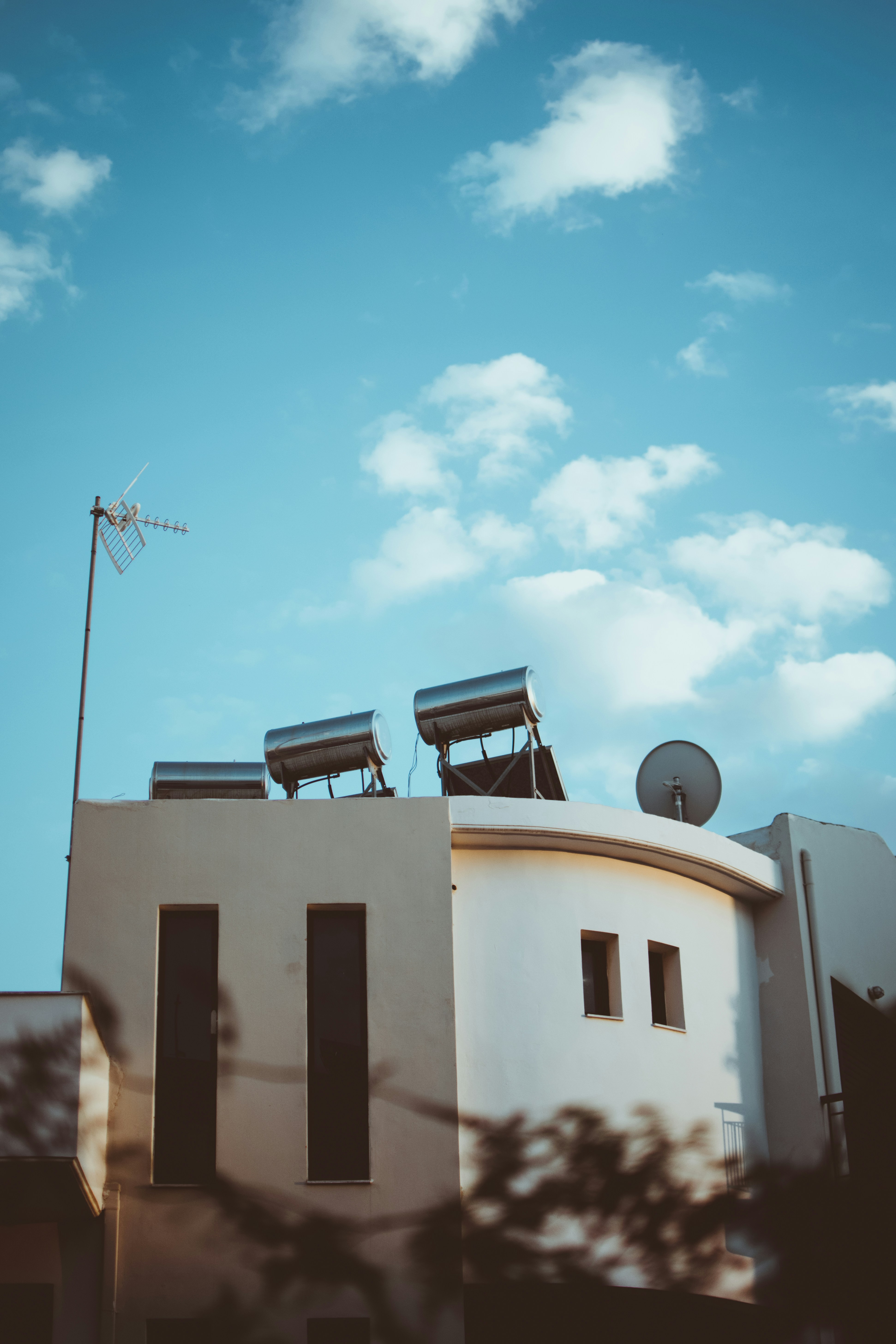 Rooftop Solar Collectors Under a Cerulean Sky