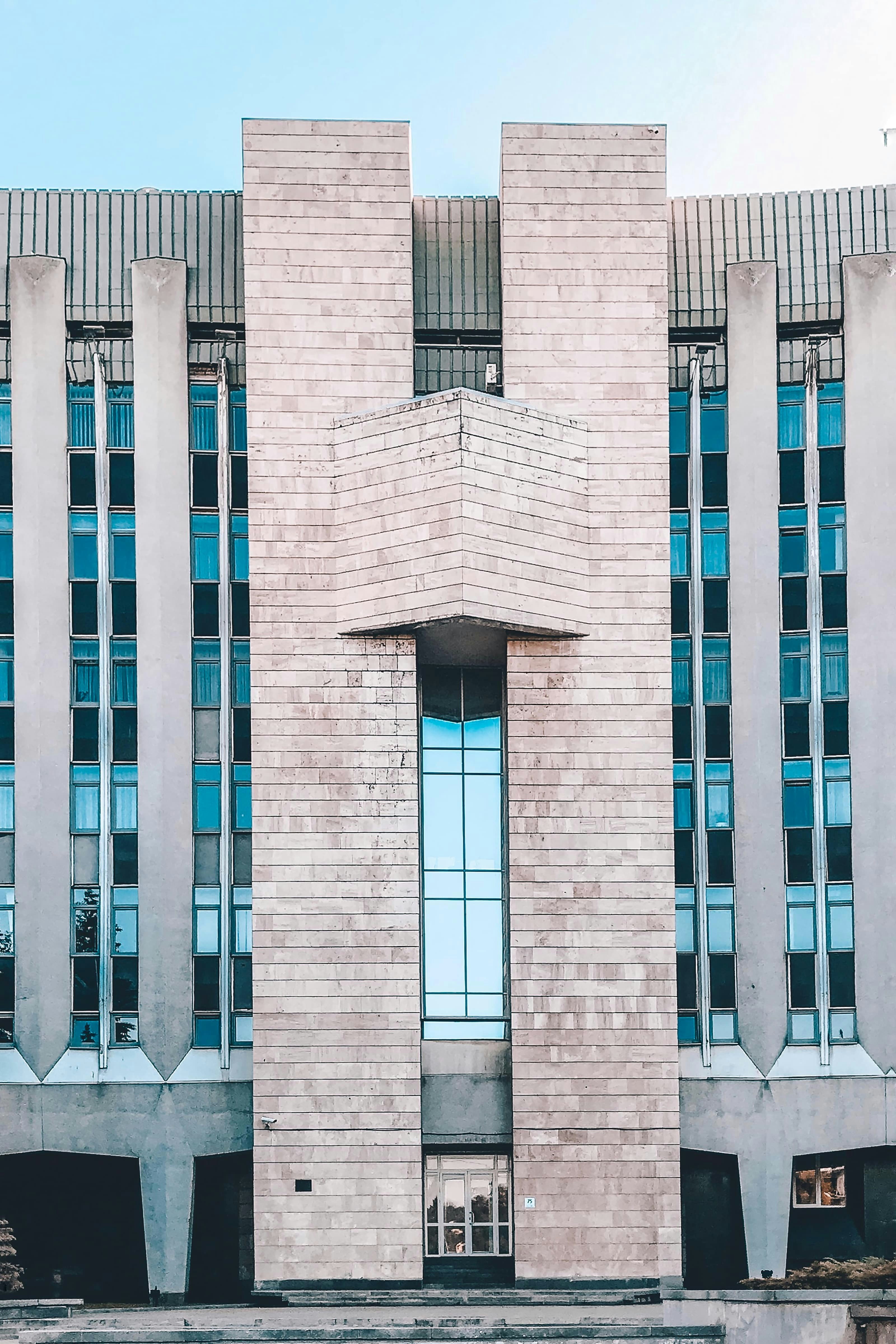 Central Concrete Pier Framing a Glass-Fronted Modernist Facade