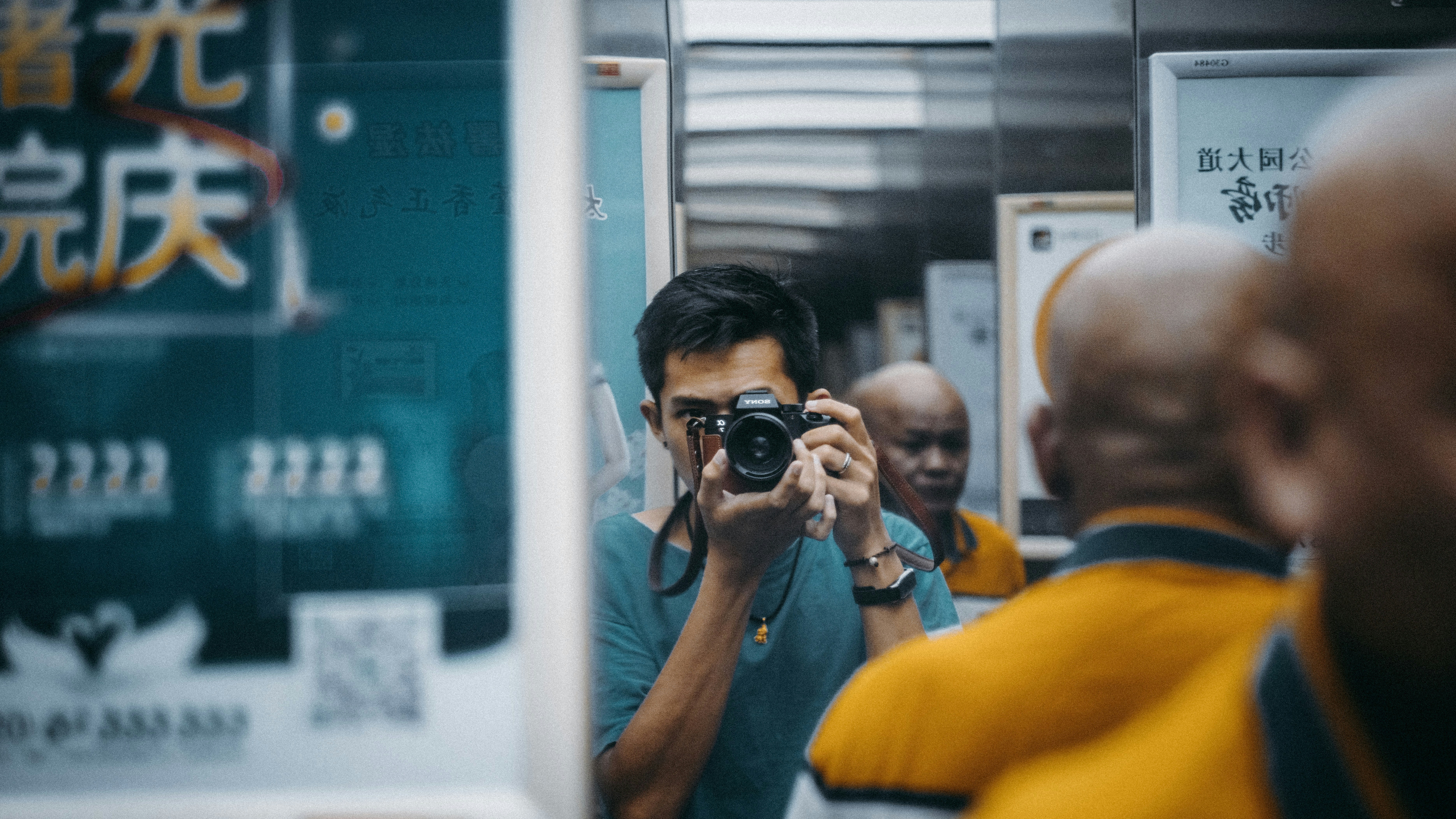 man using DSLR camera