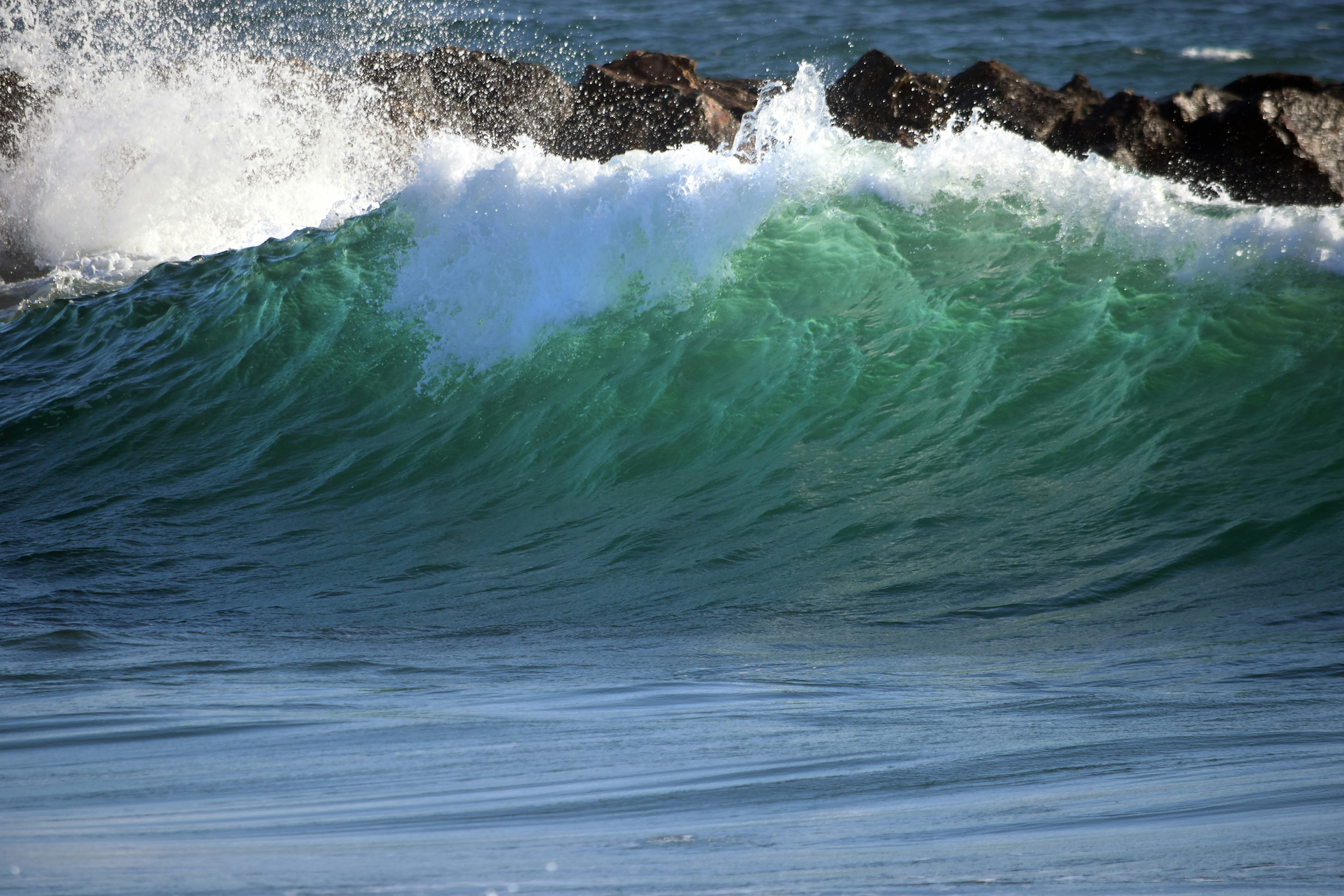 Green sea wave near rock formations during daytime photo – Free Port ...