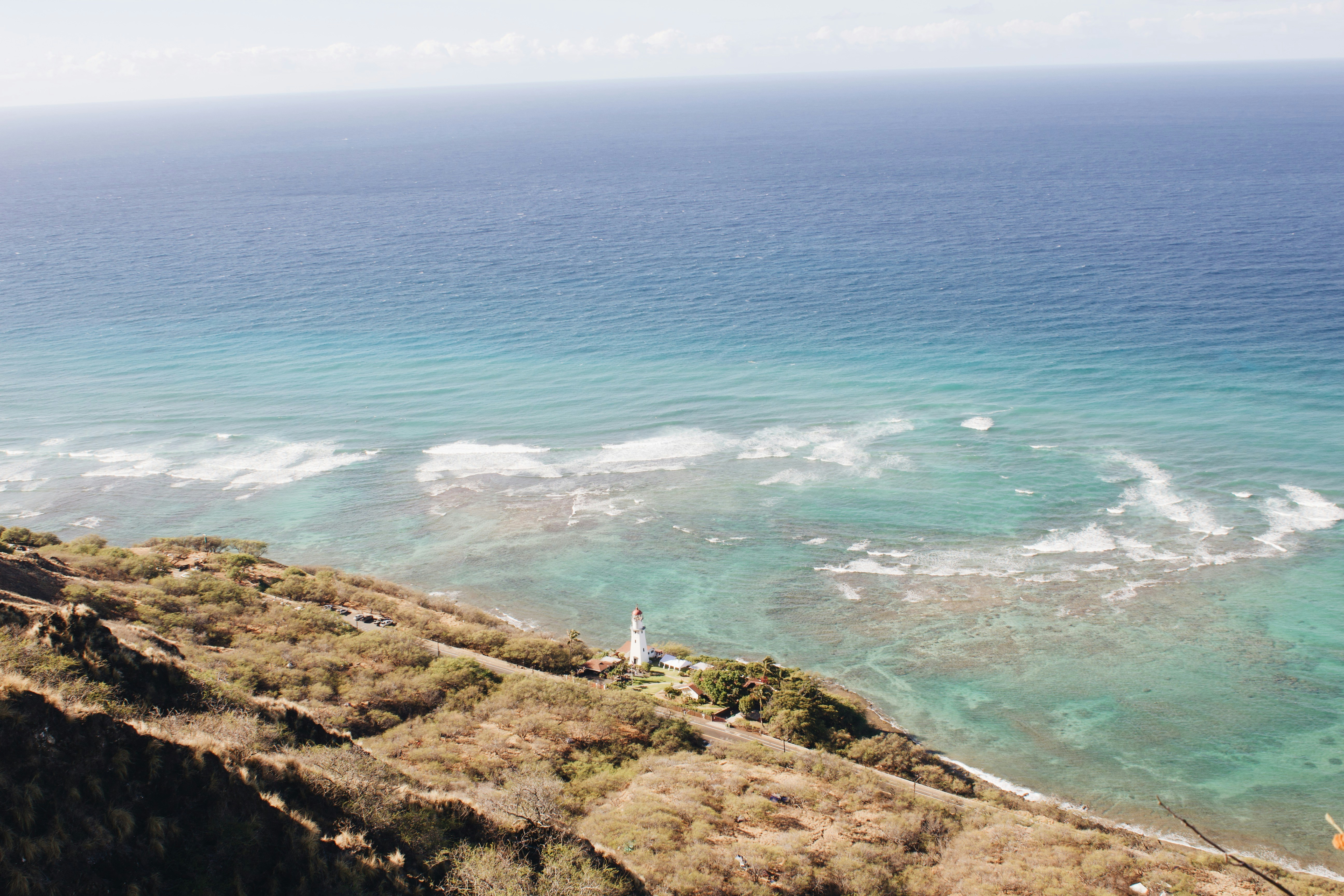 Lighthouse Keeper's Crest: A Quiet Beacon Over Turquoise Waters