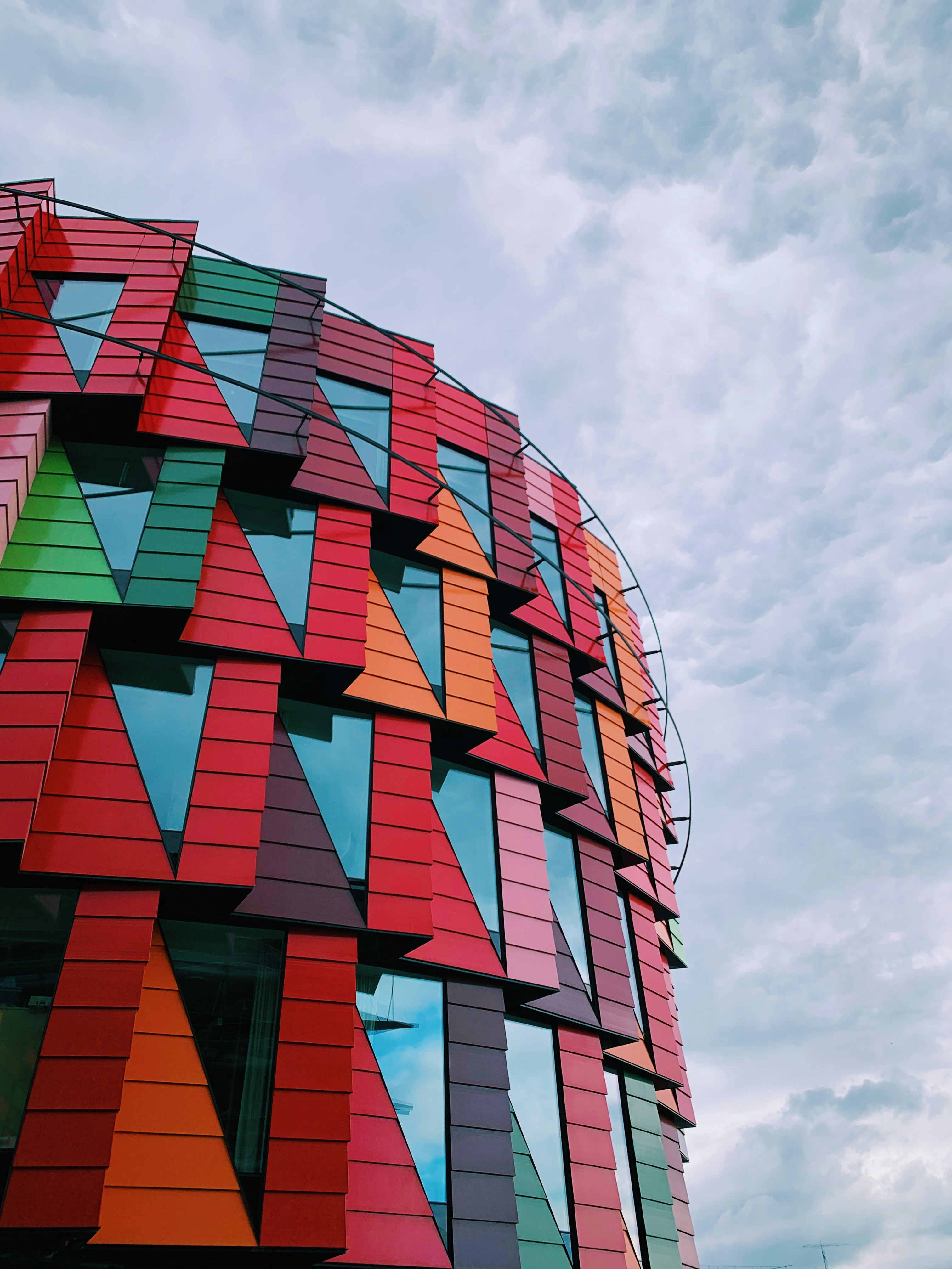 A multicolored building with a sky background photo – Free Building ...