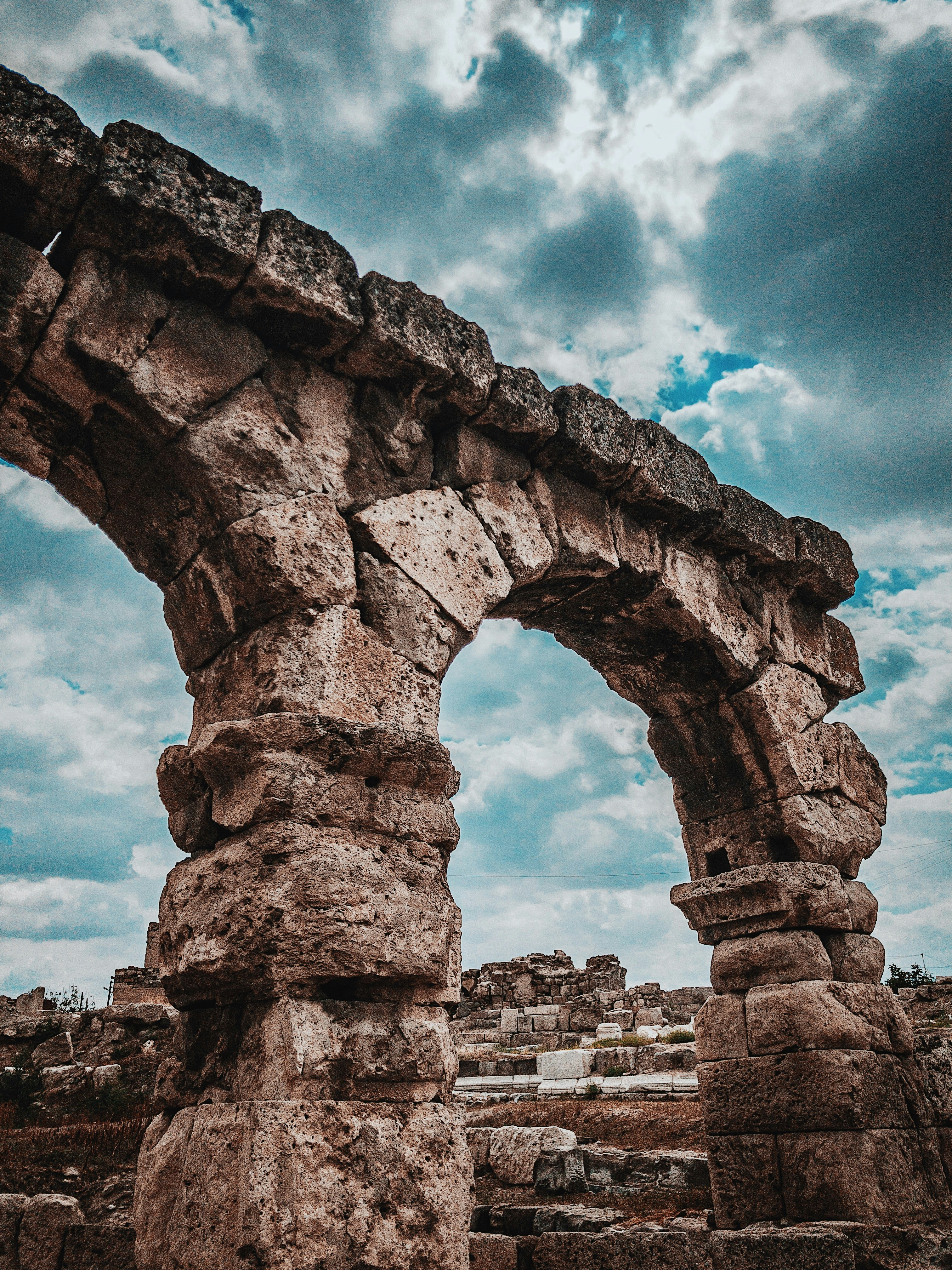 Timeworn Archway Against a Turquoise Sky