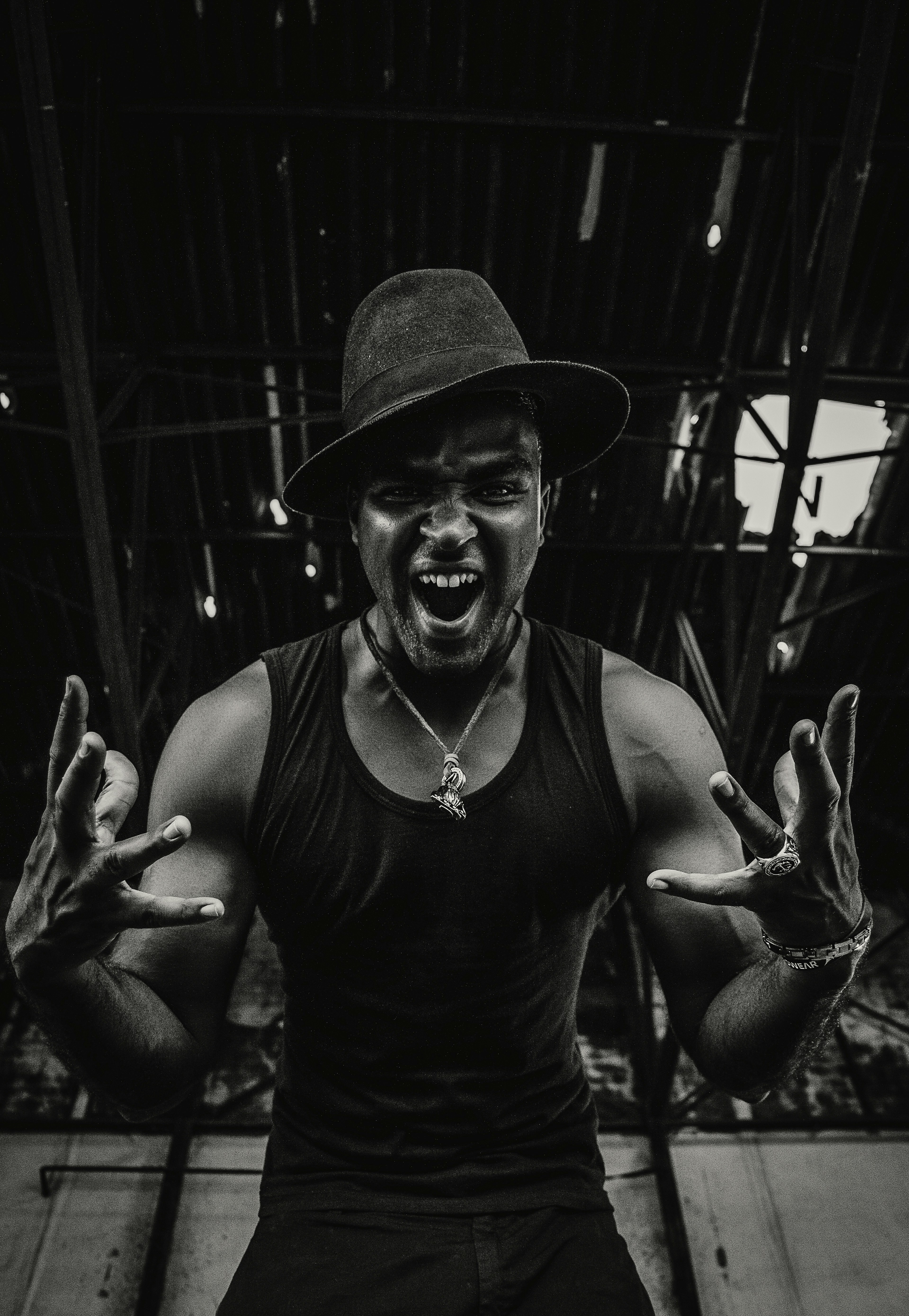 Noir Stage Roar: A Black-Hat Portrait of Raw Energy