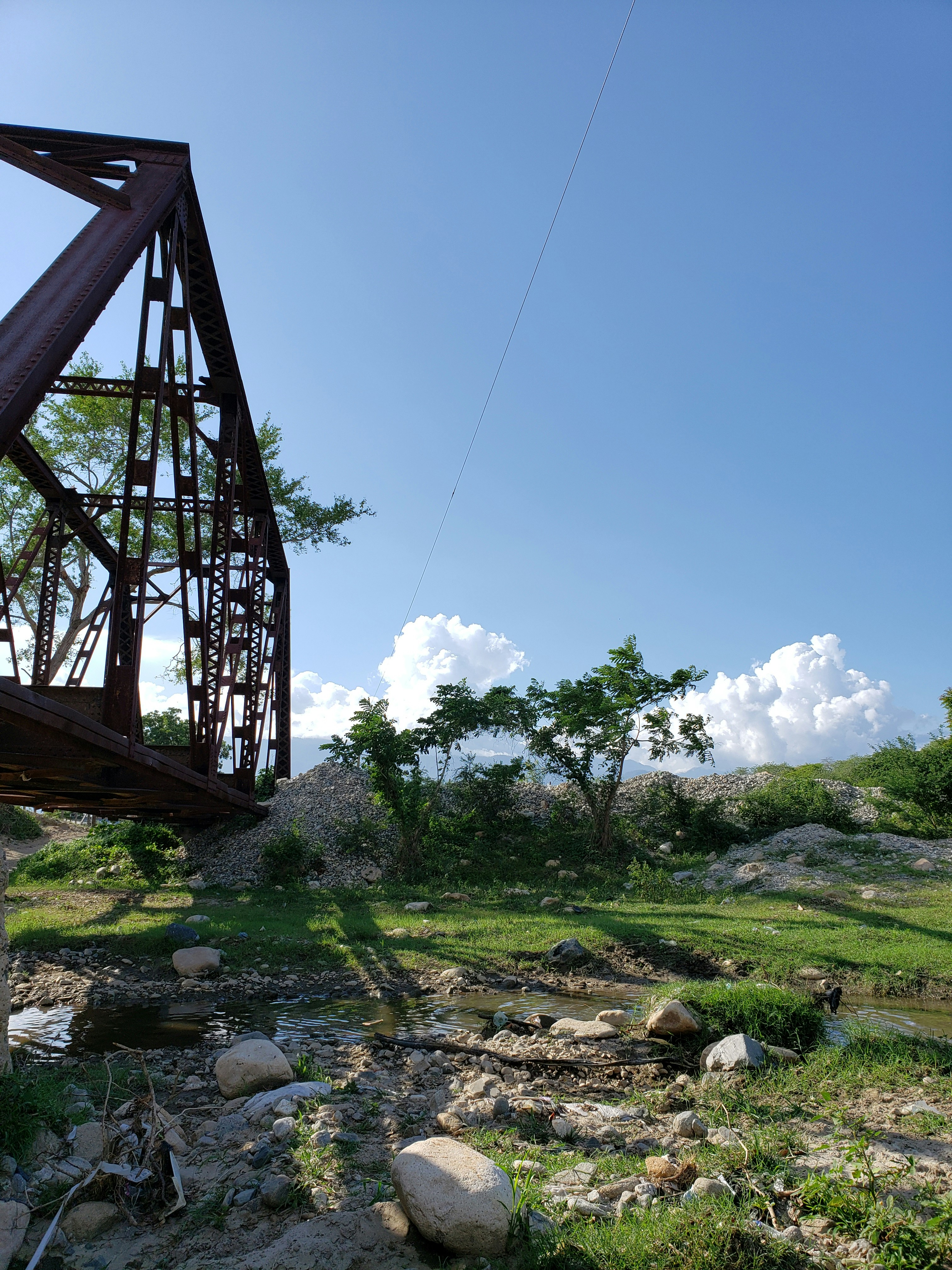 Rustic Bridge Amidst Verdant SceneryEnrique Marroquín