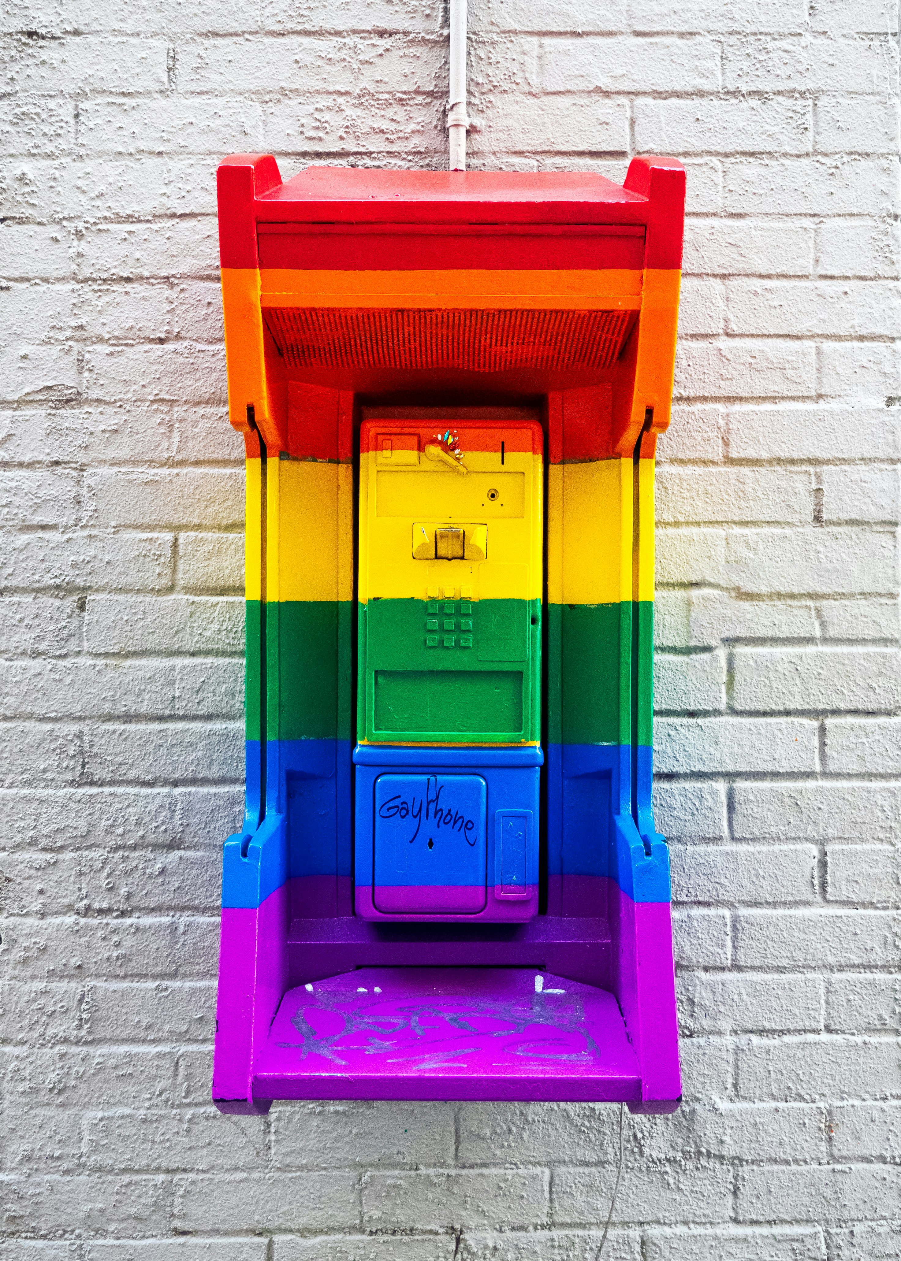 A multicolored box on the side of a building photo – Free Phone Image ...