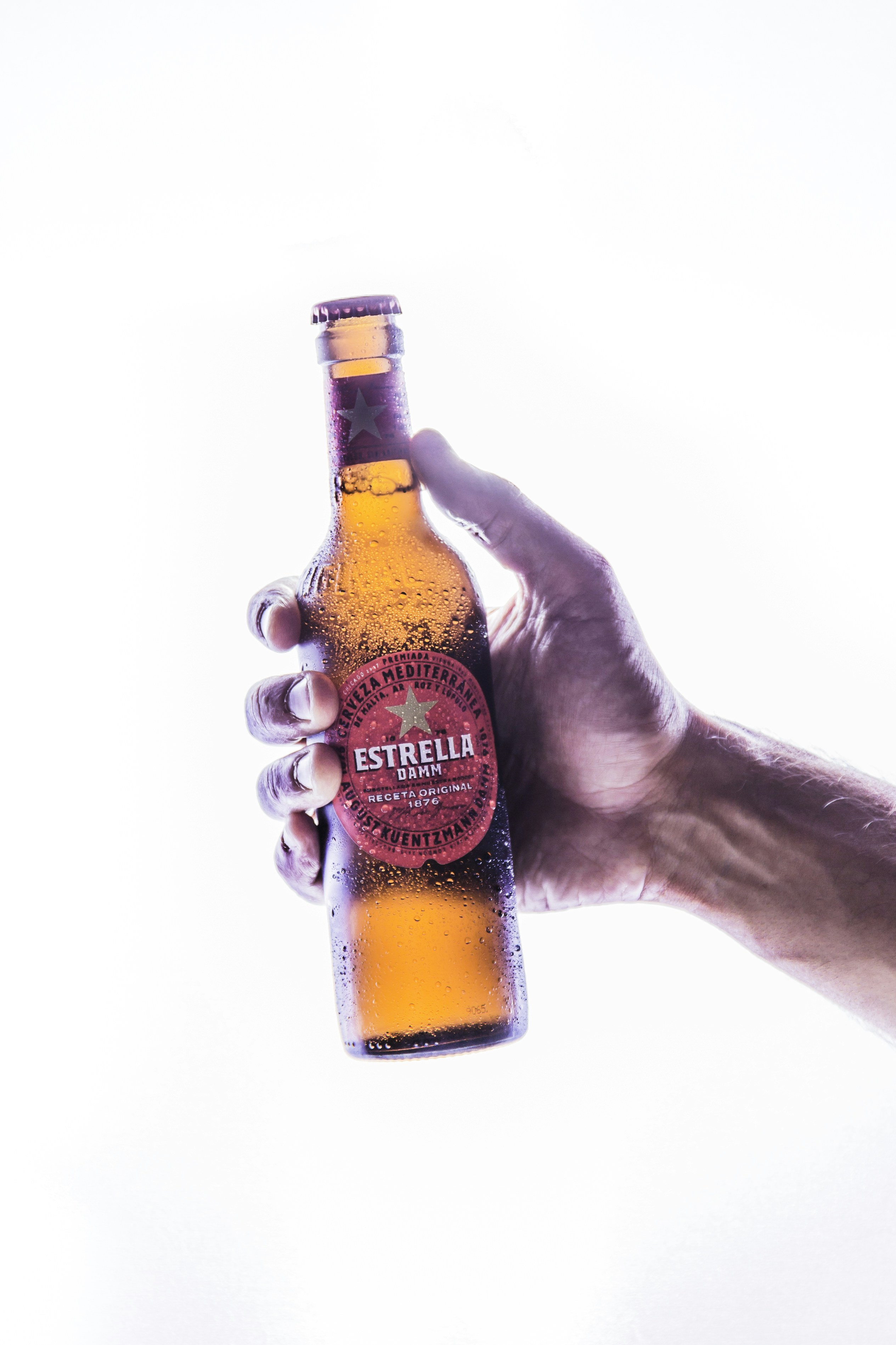 Gripped Glow: Hand Cradles a Frosted Estrella