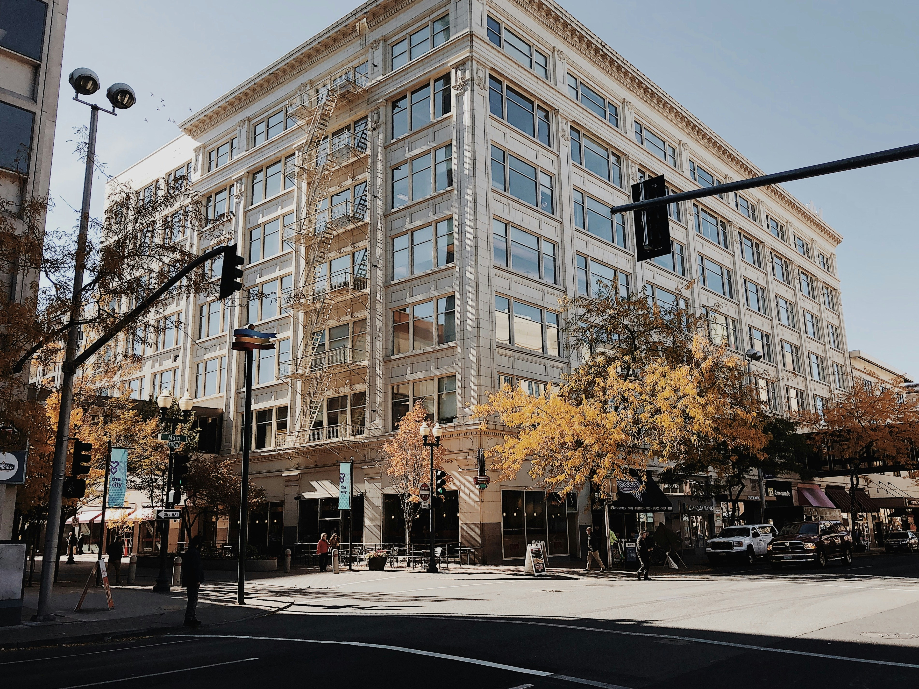 Downtown in Spokane Washington during the fall.  | traffic lights near building