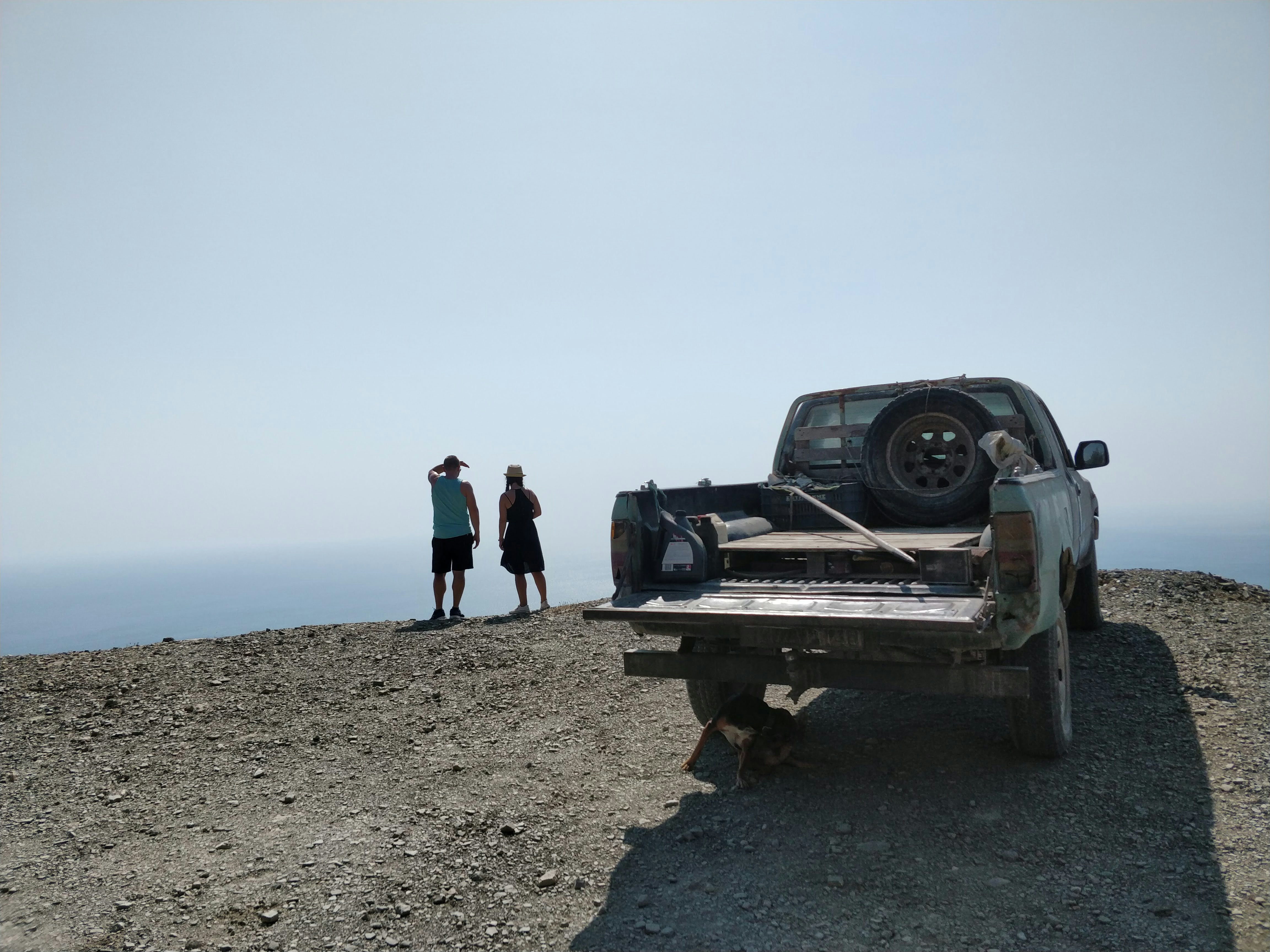 Sun-bleached Desert Meetup by a Weathered Pickup