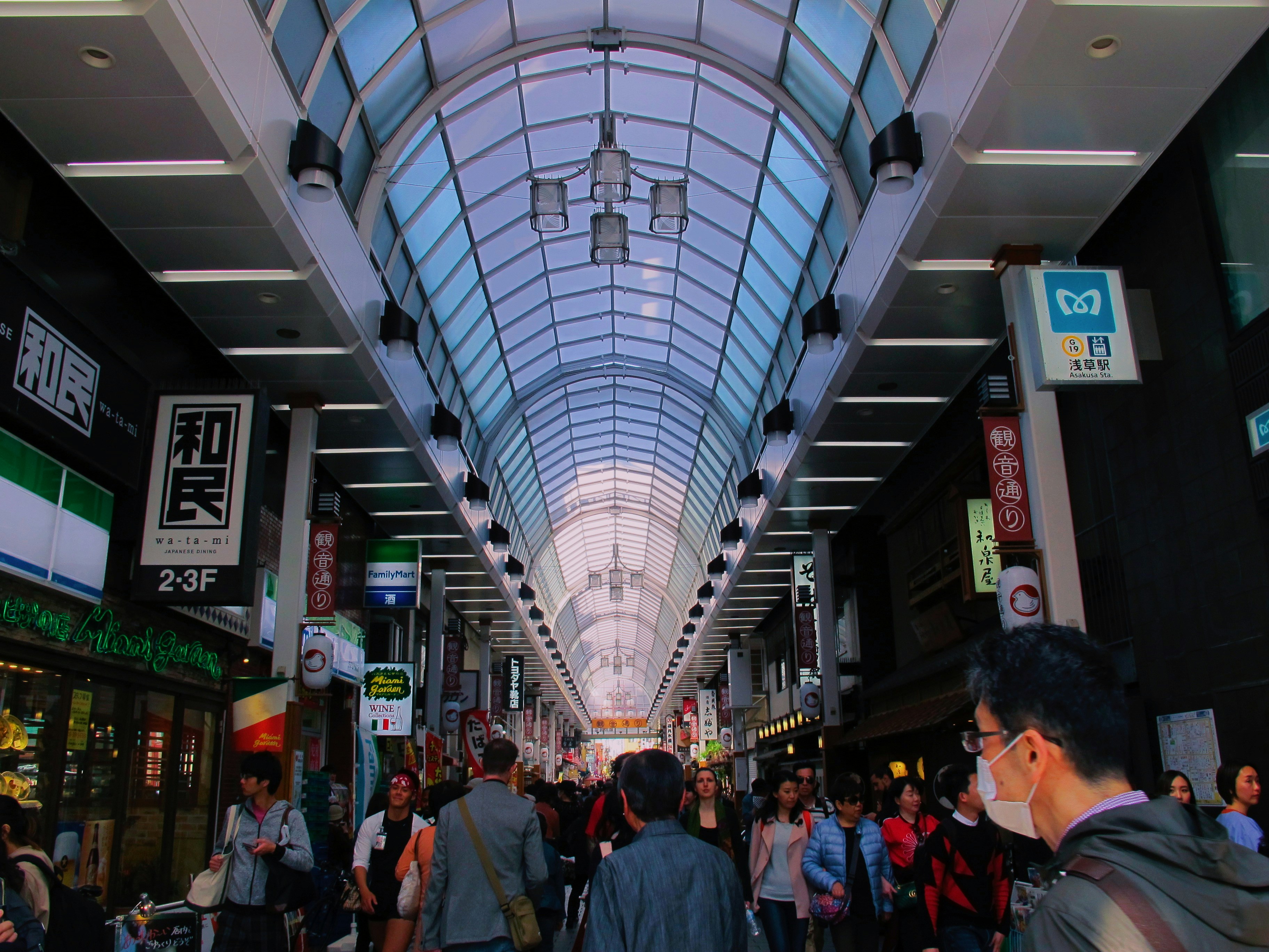 People walking between buildings photo – Free Grey Image on Unsplash