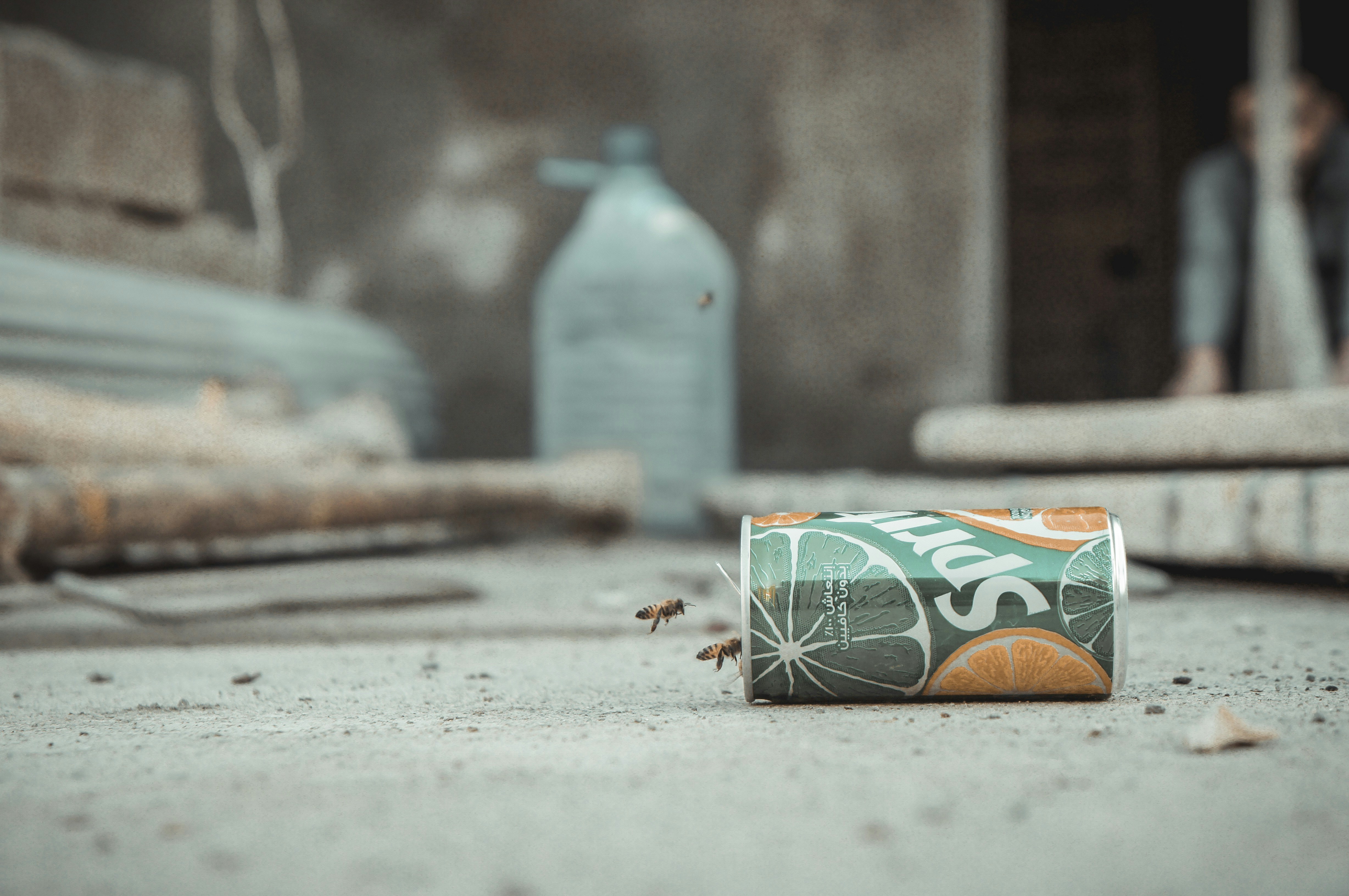 Green and orange Sprite can lying on pavement photo – Free Grey Image ...