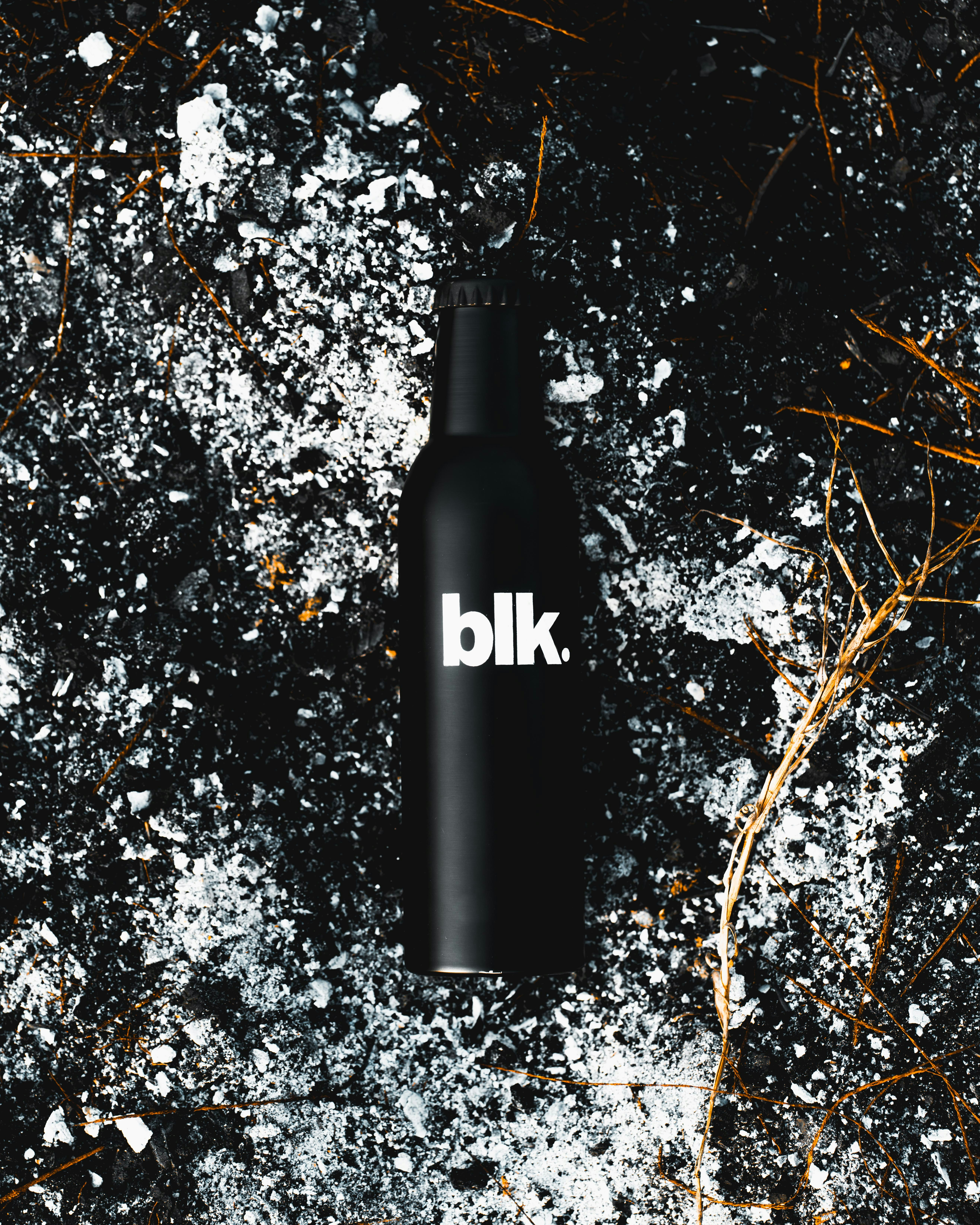Midnight Matte: Ablk Bottle Quietly Anchors Snow-dusted Ground