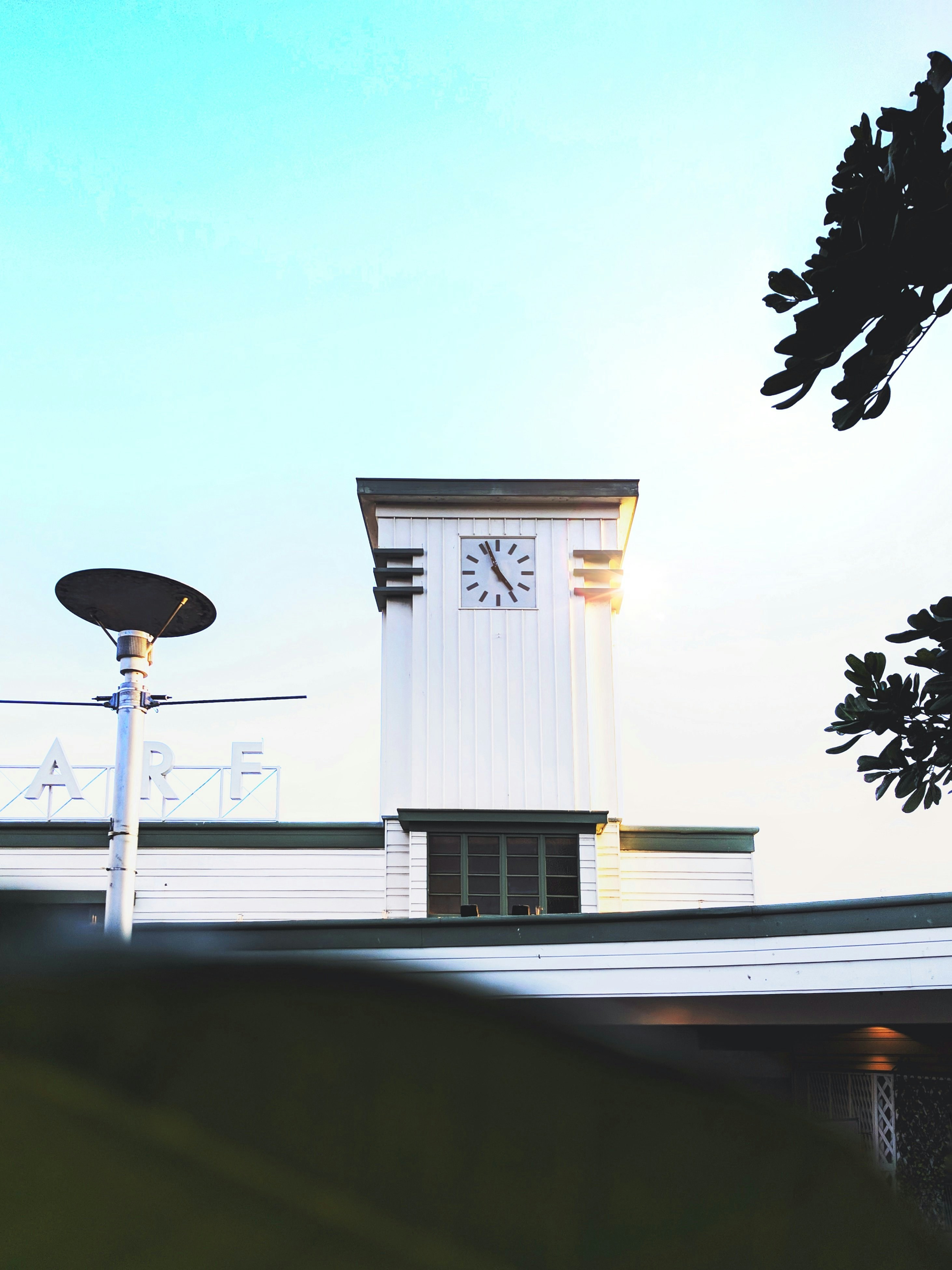 white painted building clock scenery