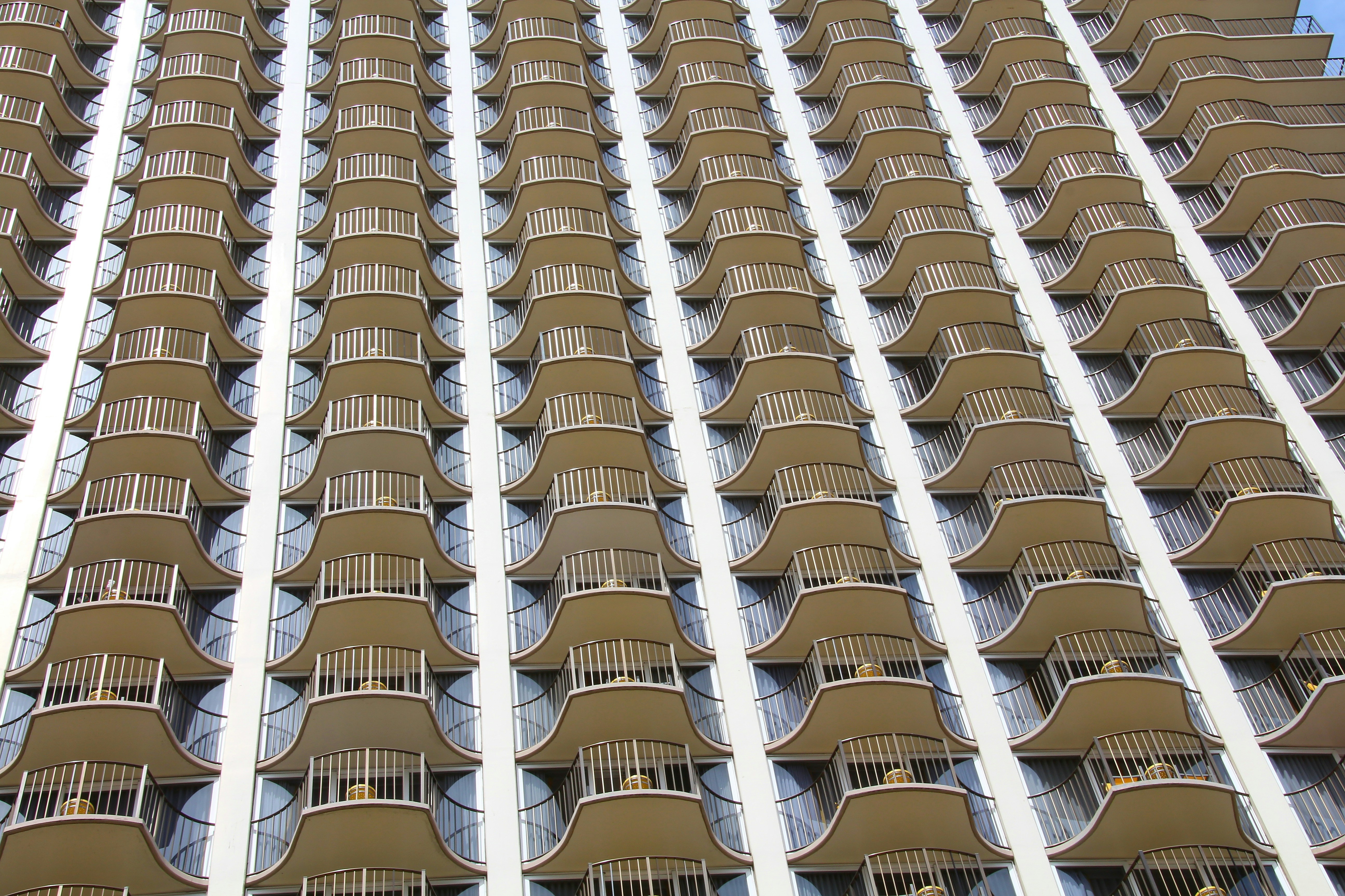 Rhythmic Facade: The Grid of Receding Balconies