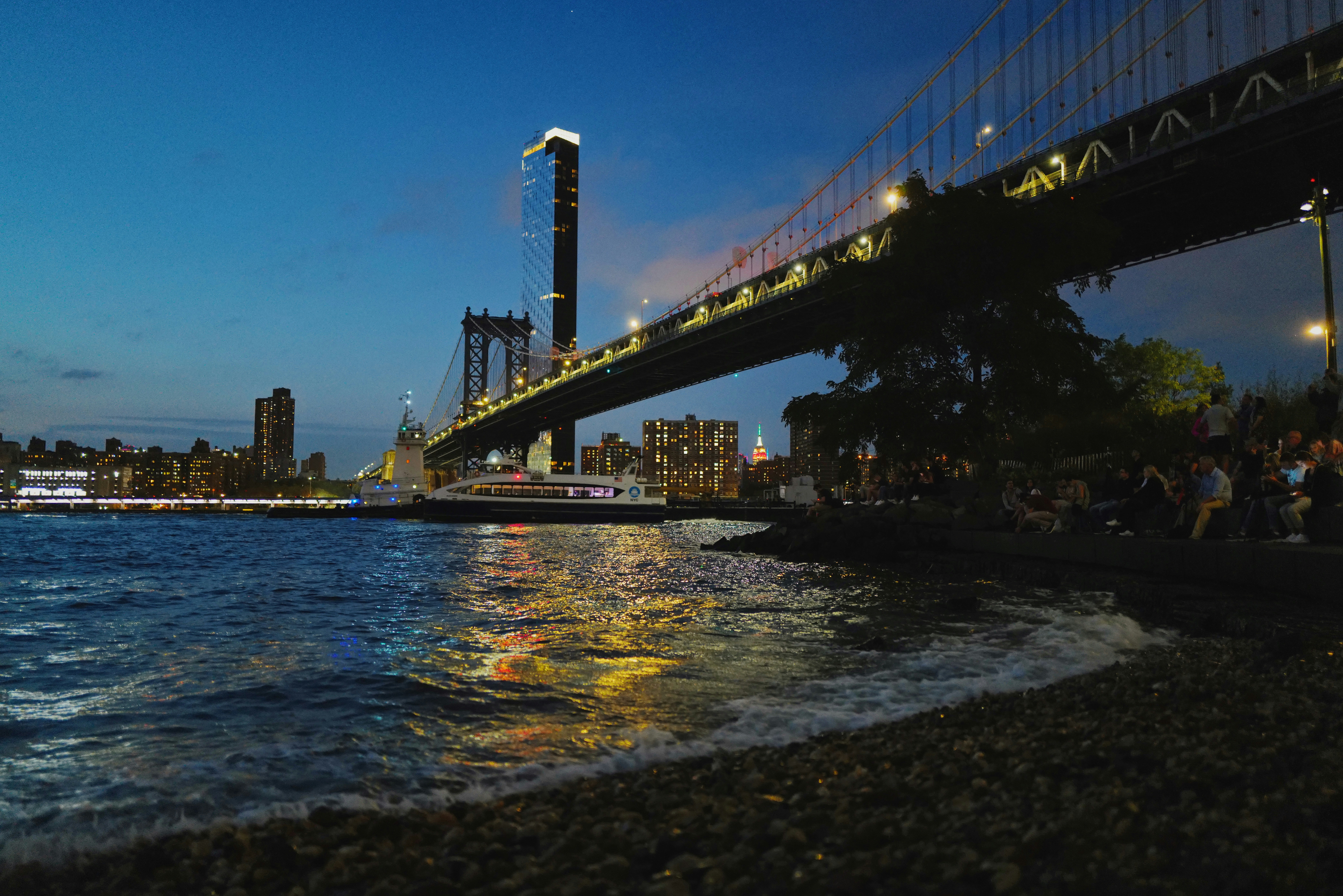Nocturnal Bridge Lightscape: Reflections Cast by City Lights on the River