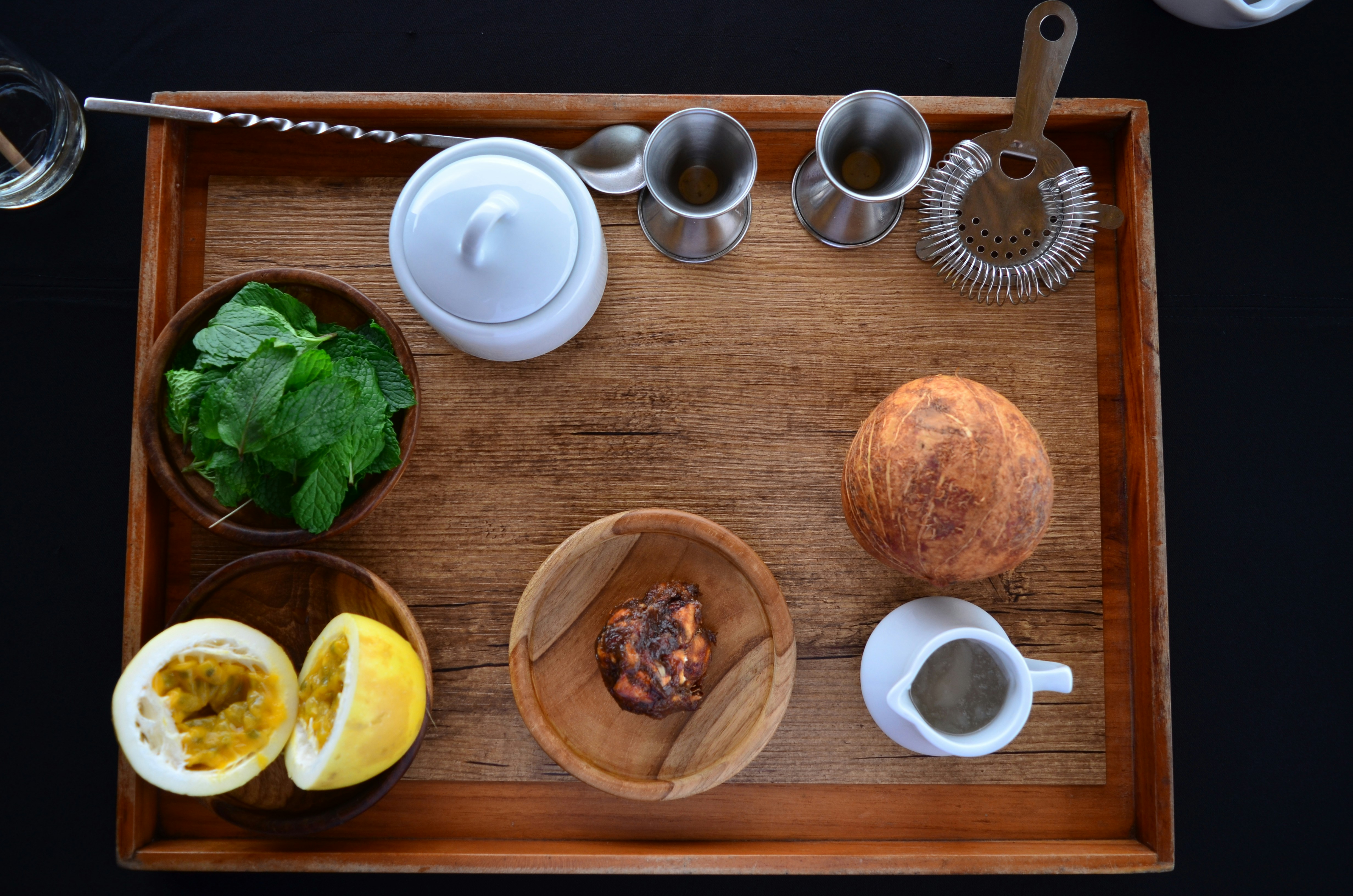 Herbal Tray ritual: mint, citrus, and roasted fruit on a wooden serving board
