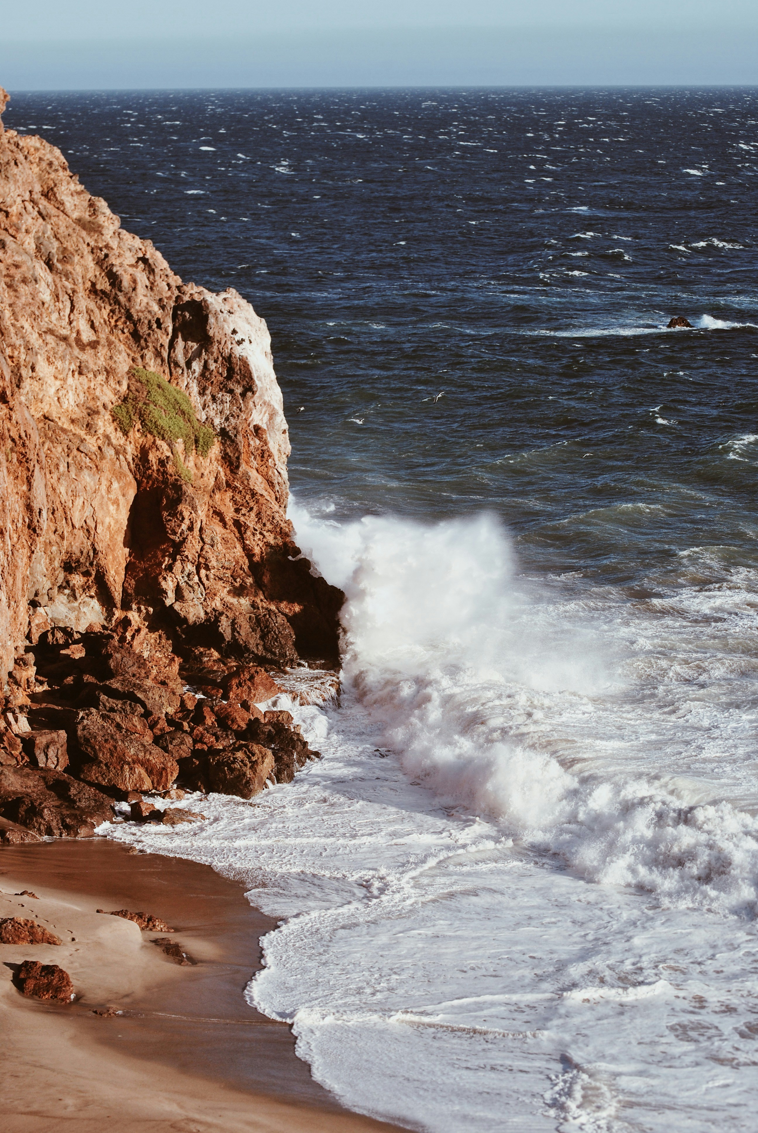 Wavy splashing on rock during daytime photo – Free Grey Image on Unsplash
