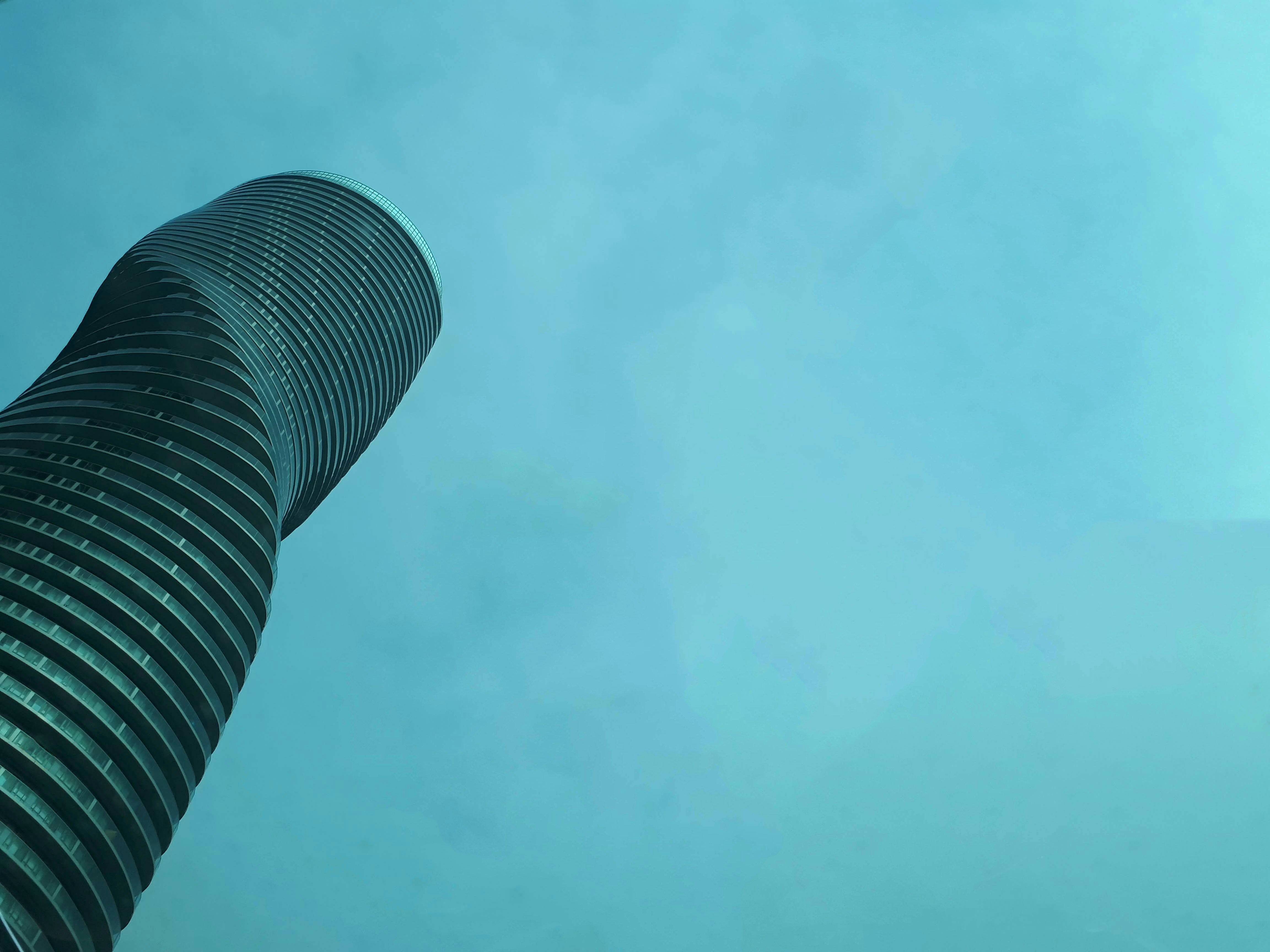Curved Sentinel Against a Cyan Sky