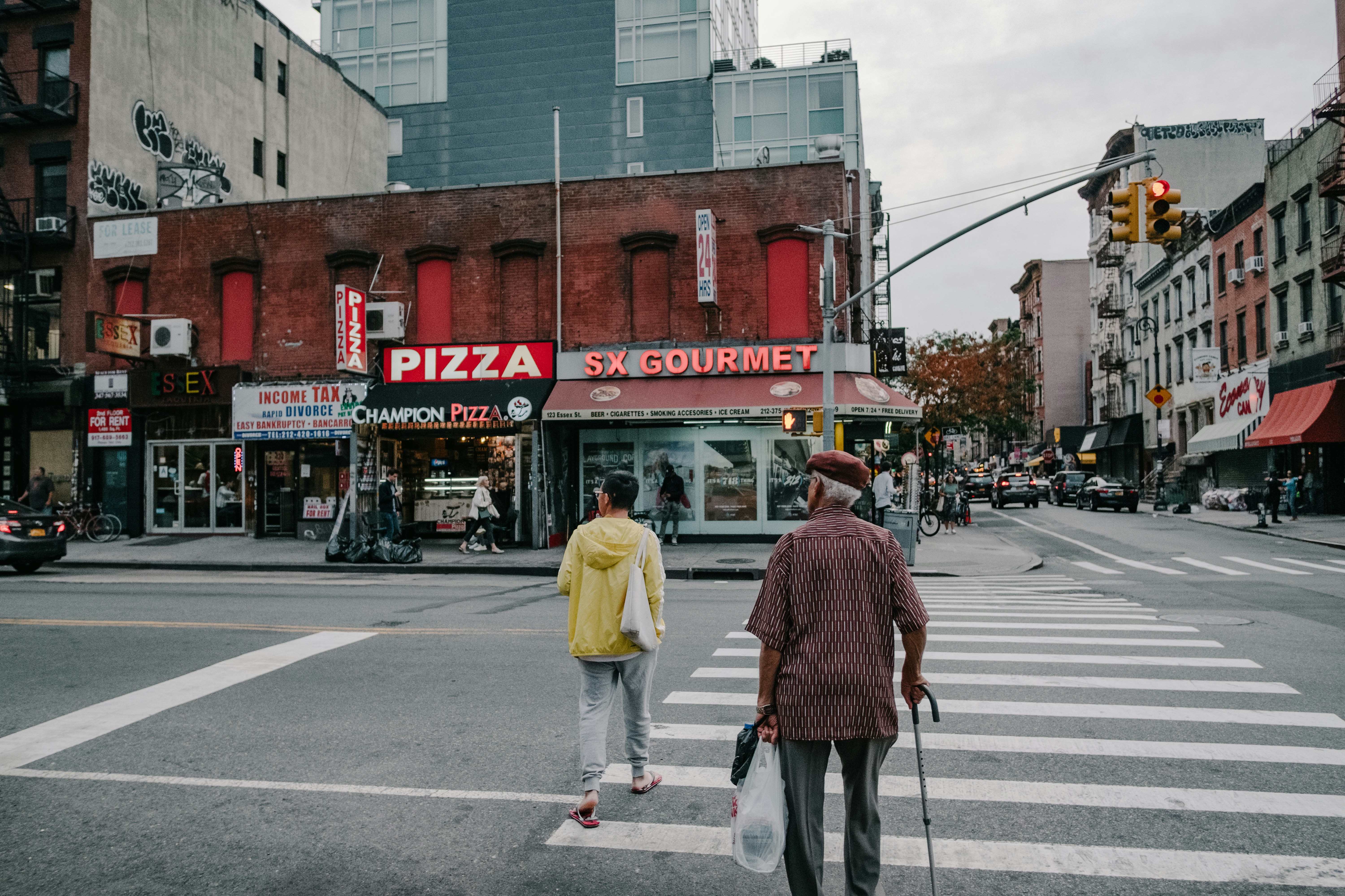 Two people crossing pedestrian lane photo – Free Manhattan Image on ...