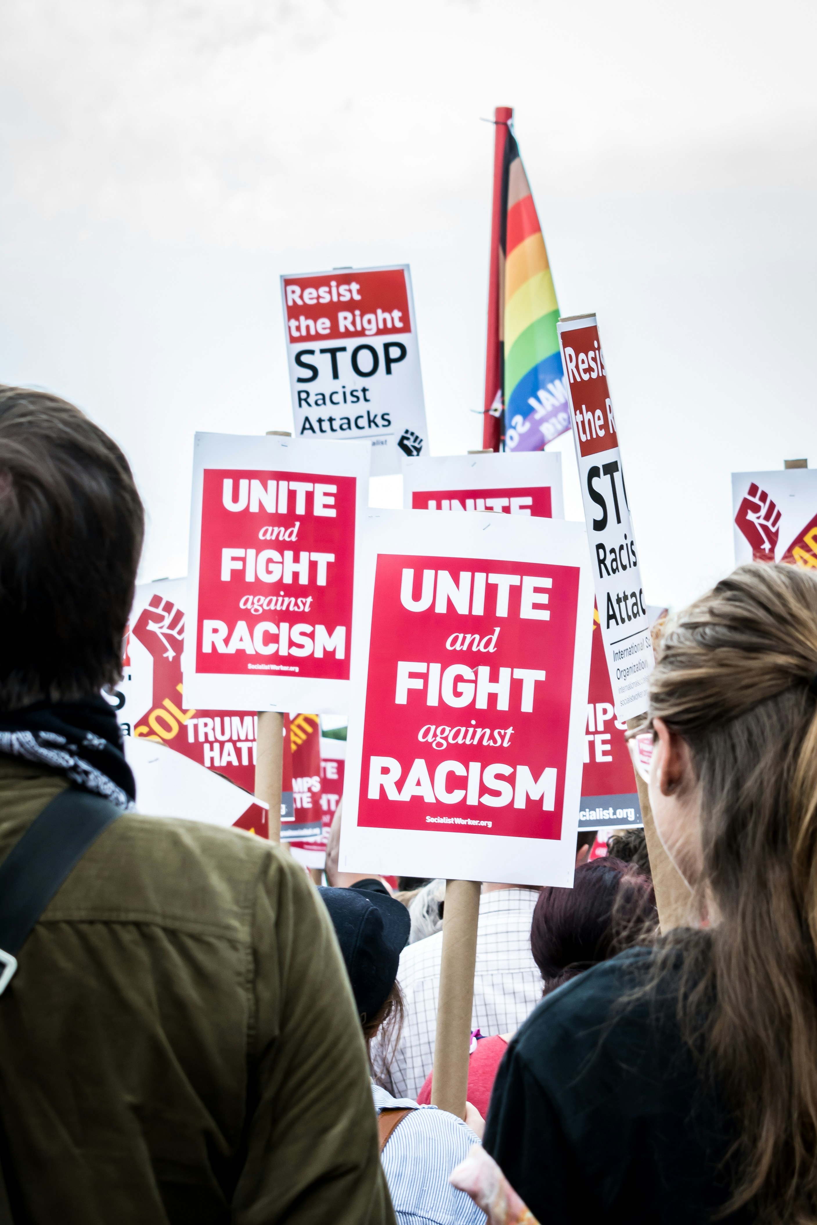 A group of people holding signs in a protest photo – Free Human Image ...