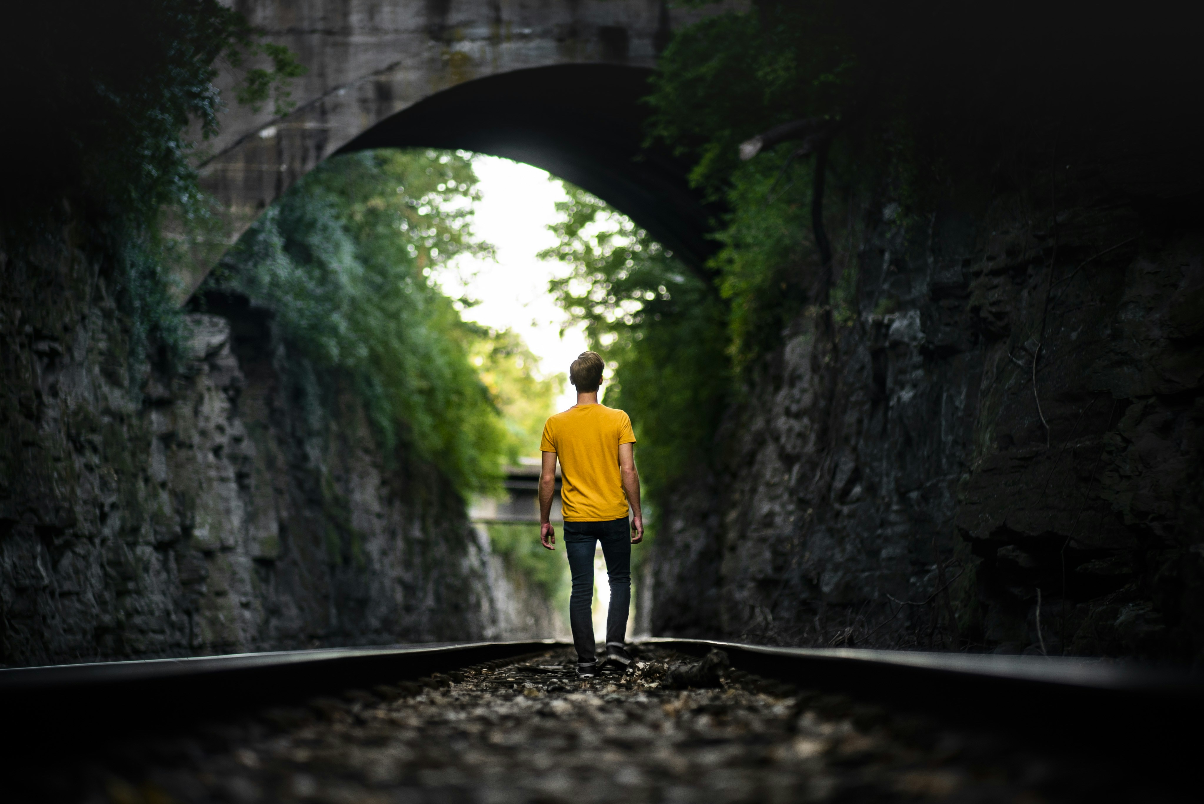 Man walking on train track during day photo – Free Nashville Image on ...